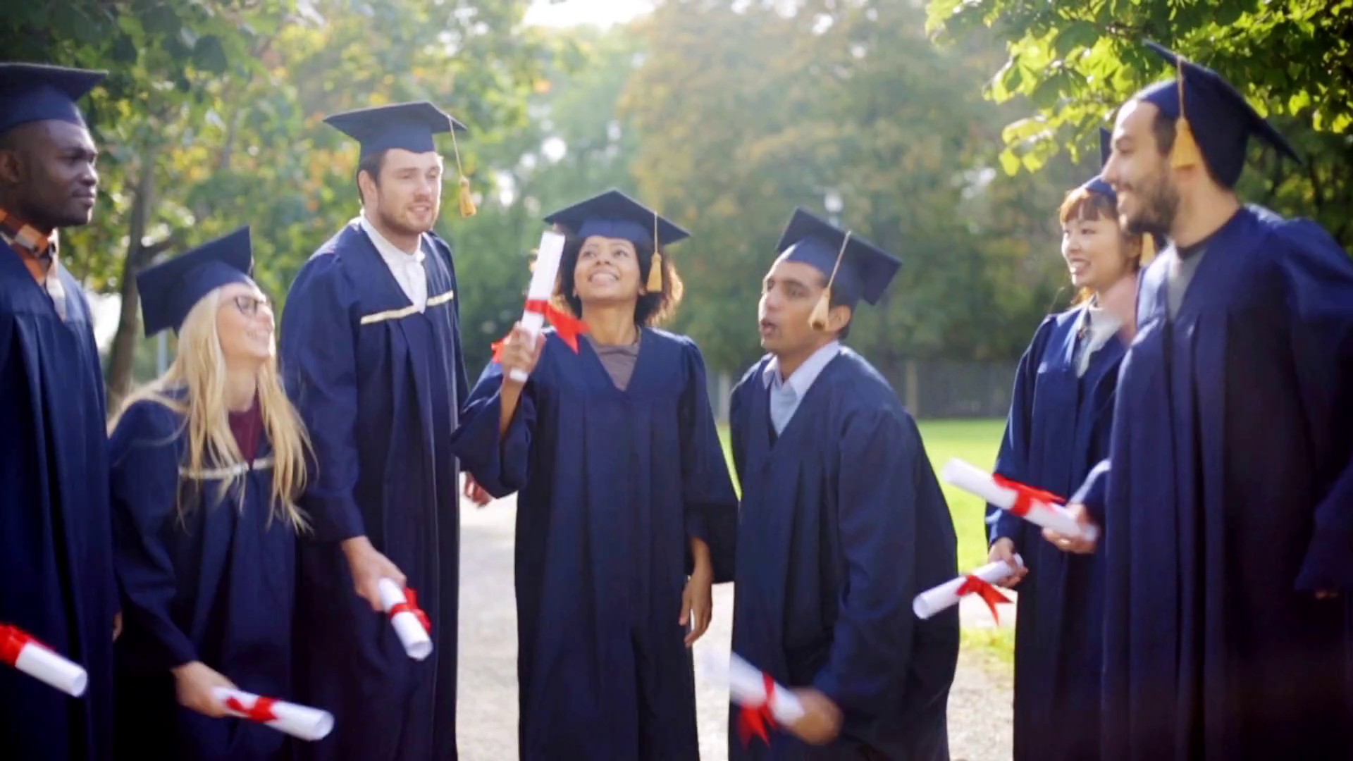 education, graduation and people concept - group of happy international ...