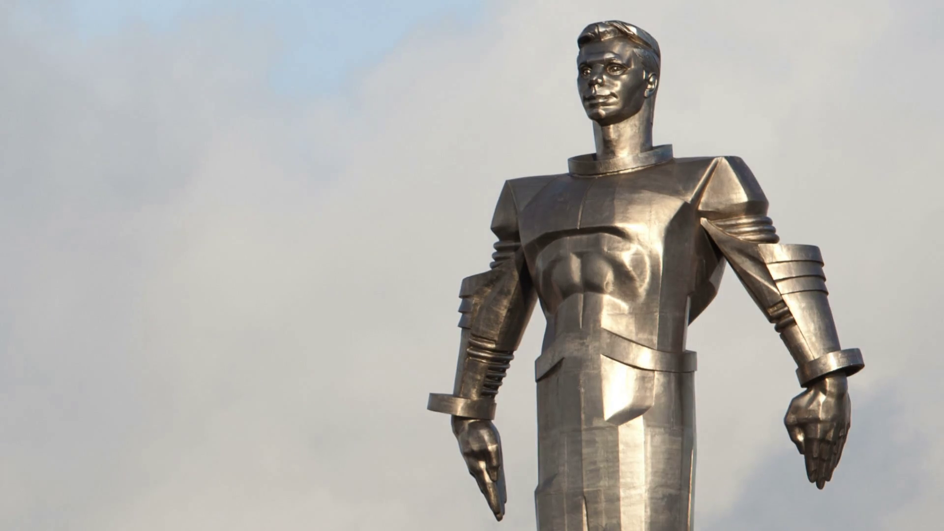 Time lapse of clouds running behind monument to Yuri Gagarin. Metal ...