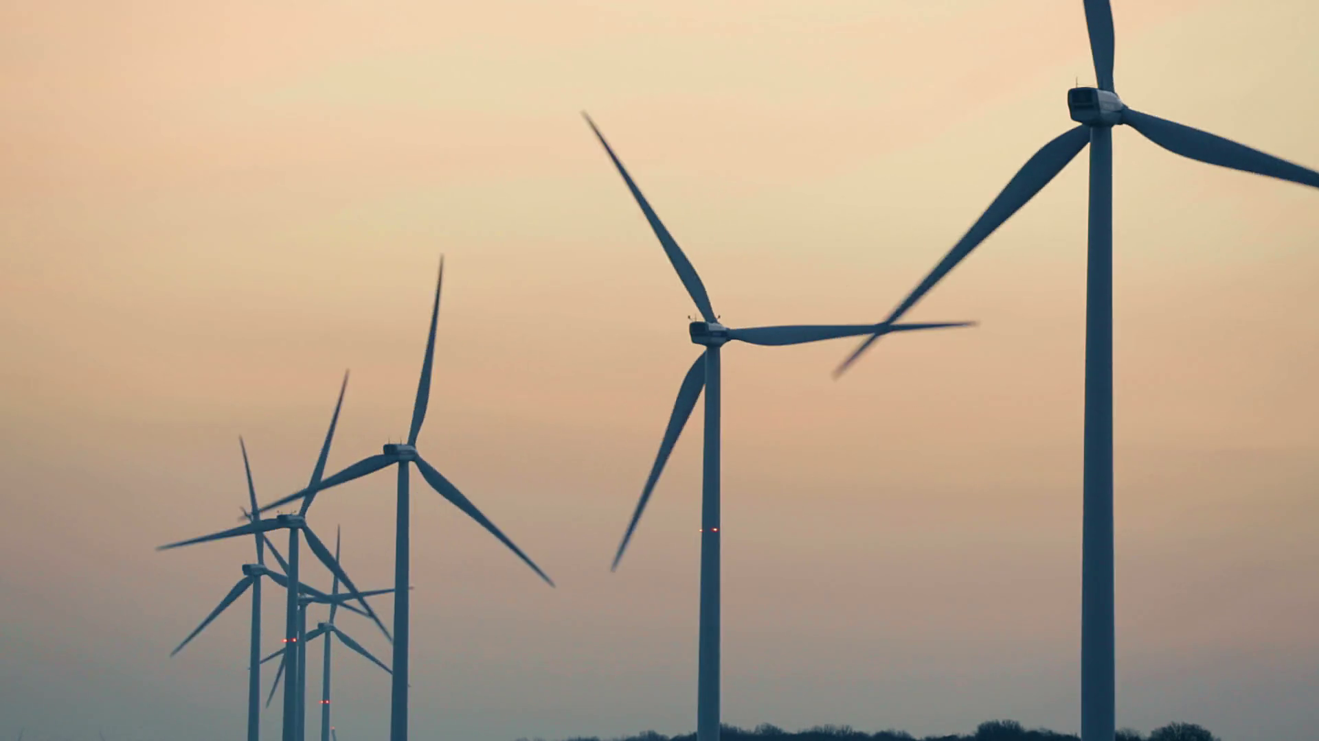 A Row Of Spinning Wind Turbines Sunrise Stock Footage SBV-305678218 ...
