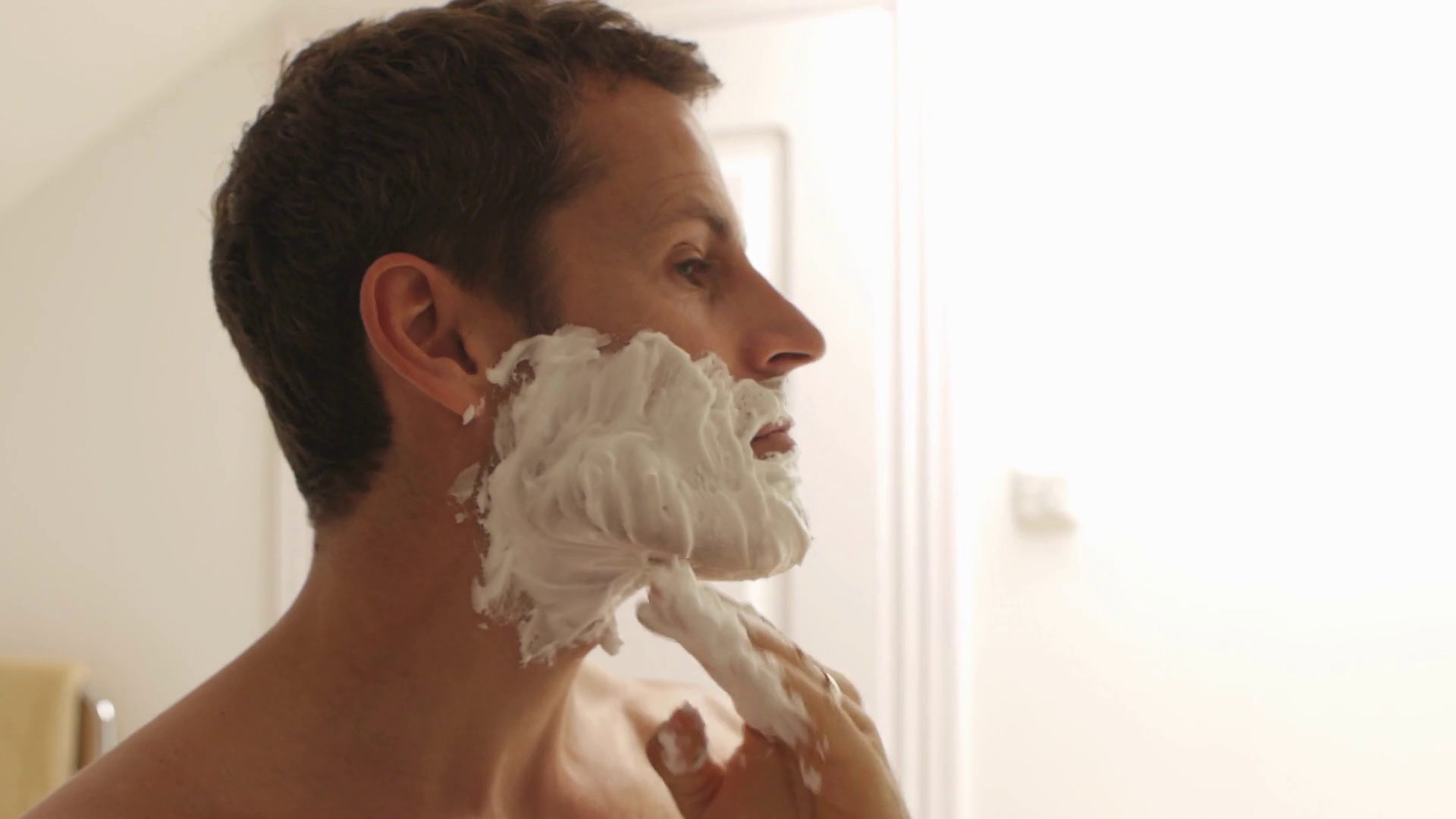 Couple Embracing Man Is Shaving Stock Footage SBV-300576310 - Storyblocks