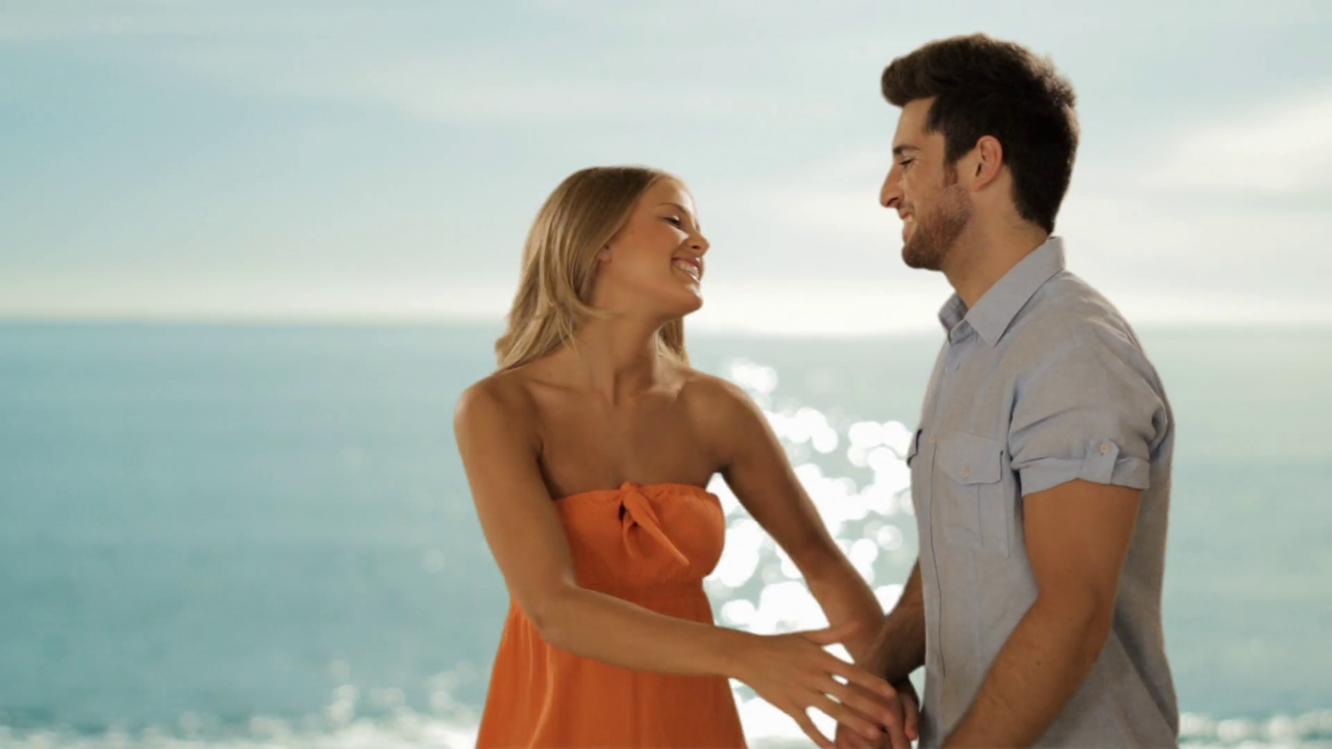 dolly shot of young couple hugging and twirling on beach Stock Video Footage 00:06 SBV-300615944 ...
