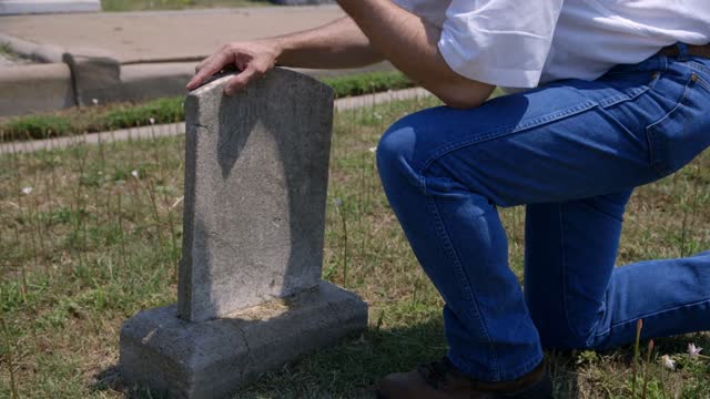 Standing Over Grave Stock Footage: Royalty-Free Video Clips - Storyblocks