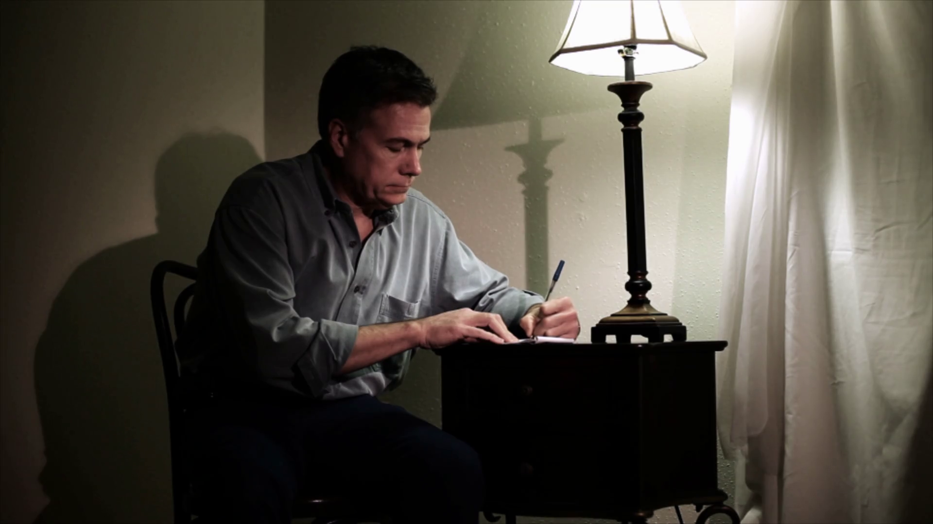 Man Writing At Small Desk Stock Footage SBV-305551203 - Storyblocks