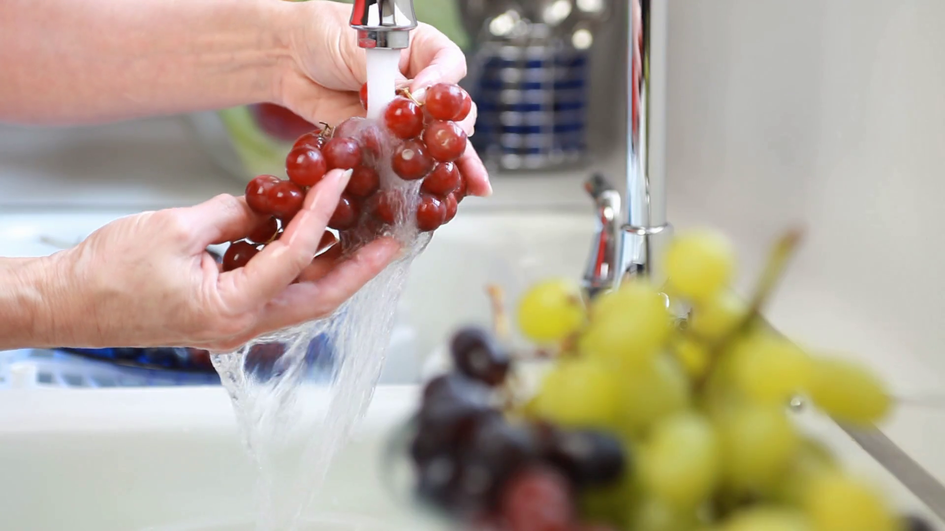 Rack Focus Woman Washing Fruit Stock Footage SBV-300964744 - Storyblocks