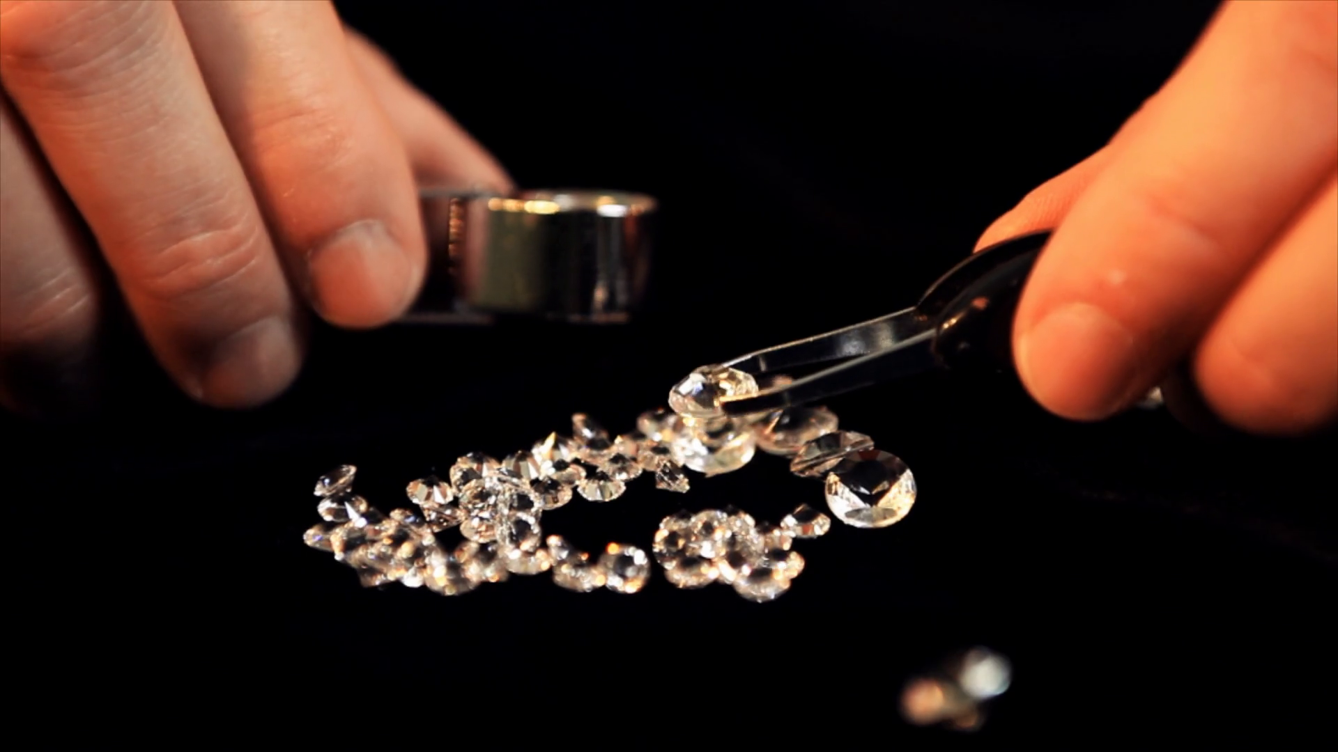 Tilt Up Jeweler Looking At Diamonds Stock Footage SBV-300970320 ...