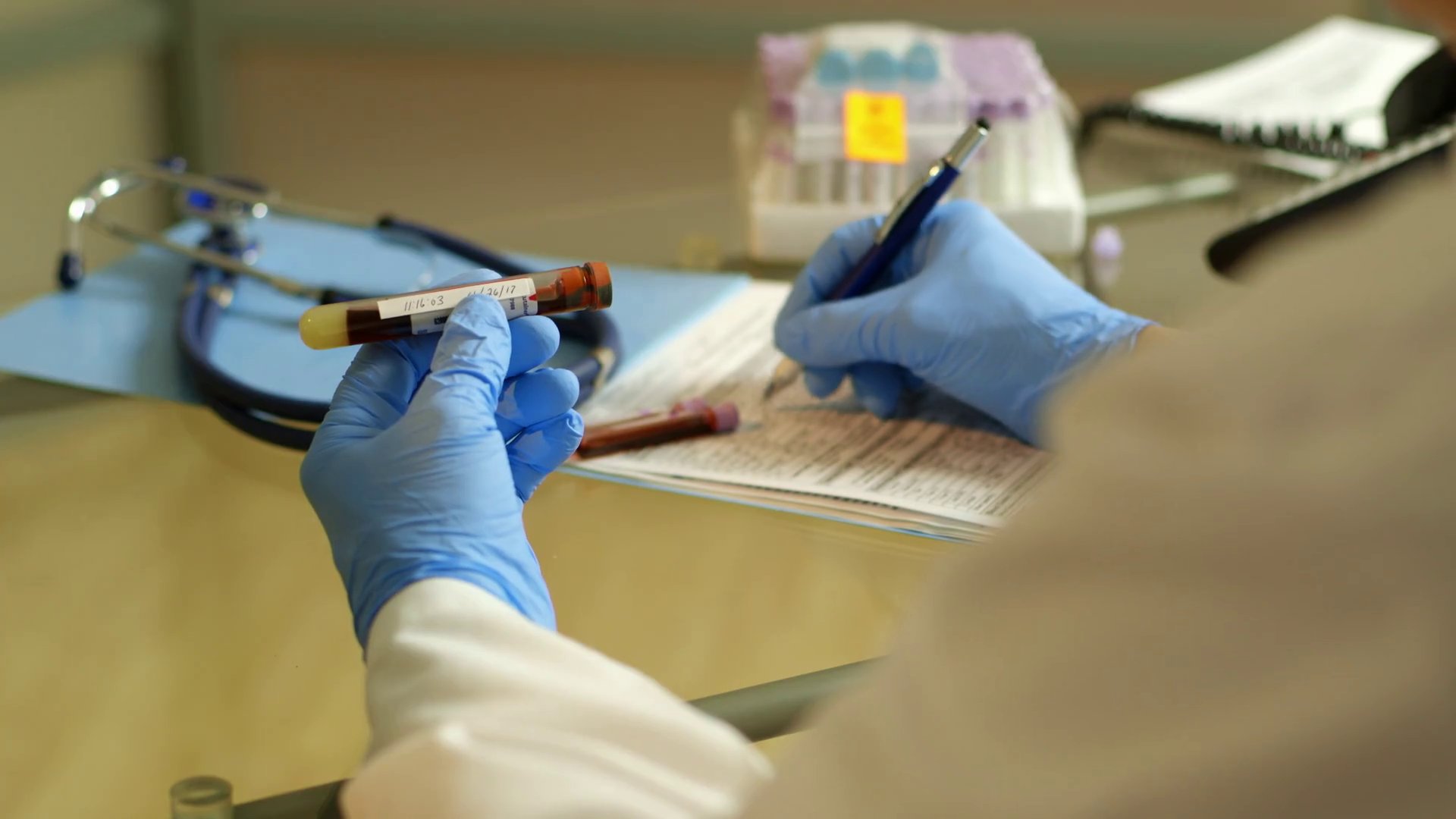 Over Shoulder Doctor Writing On Form Blood Stock Footage SBV-314595769 ...
