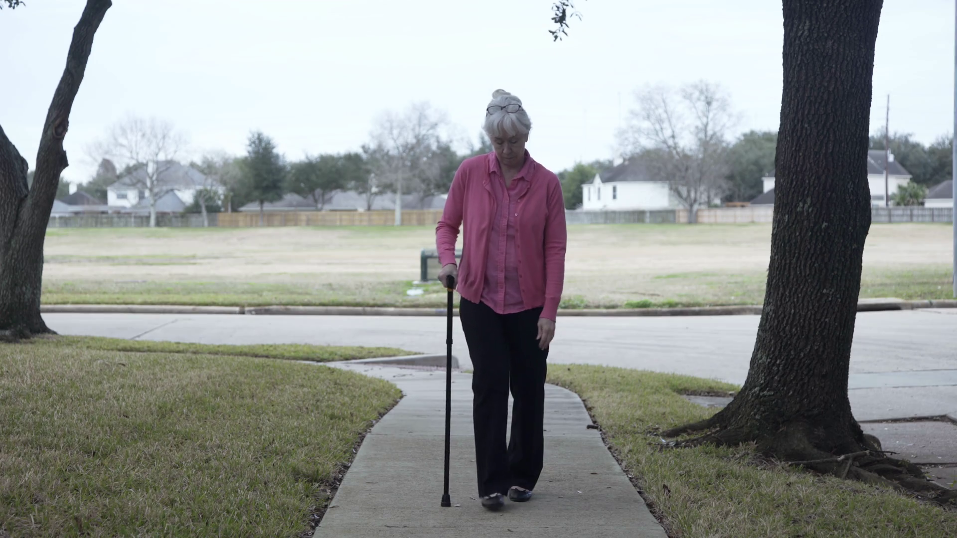 Woman Walking With Cane On Suburban Sidewalk Stock Footage SBV ...