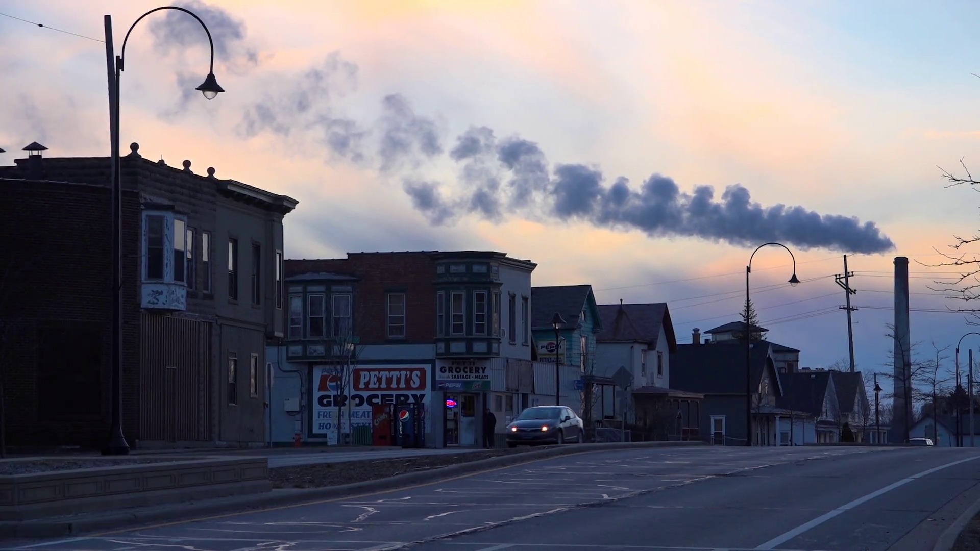 A Smokestack Belches Pollution Over Michigan Stock Footage SBV ...