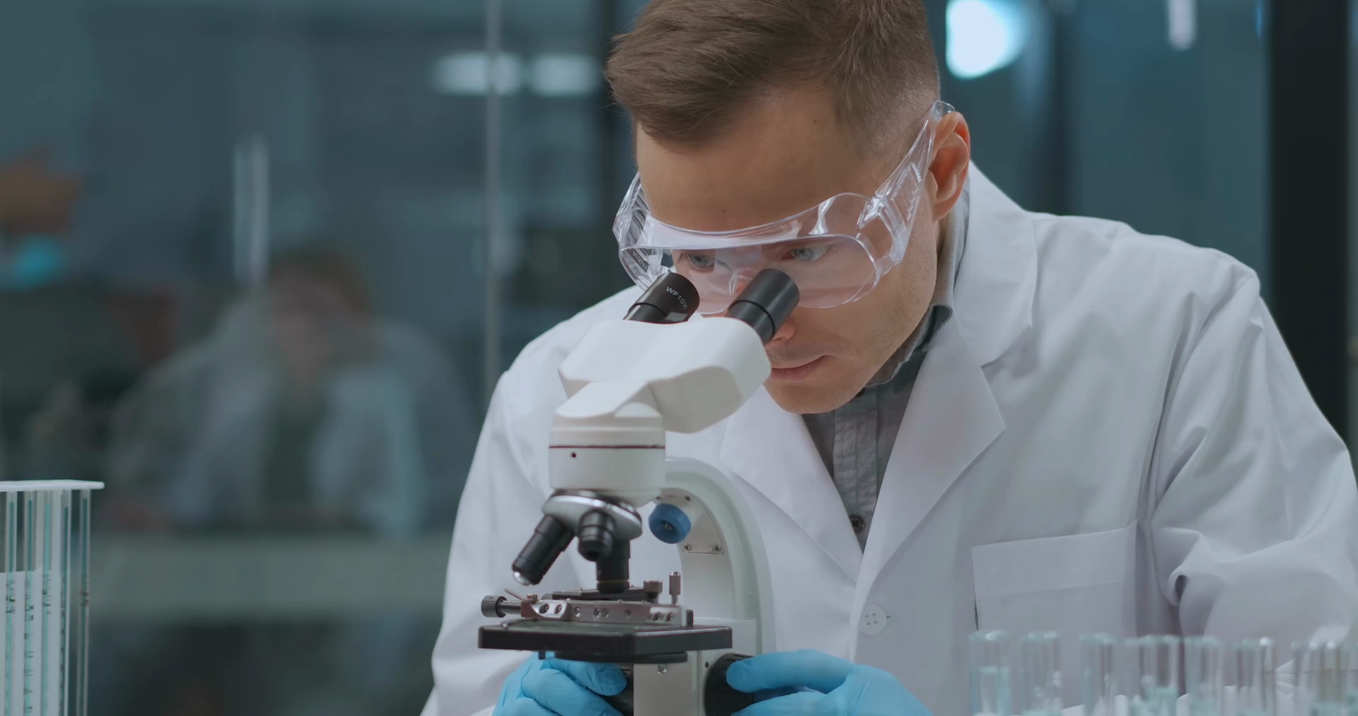 Male Microbiologist Is Exploring Sample In Stock Footage SBV-338883175 ...