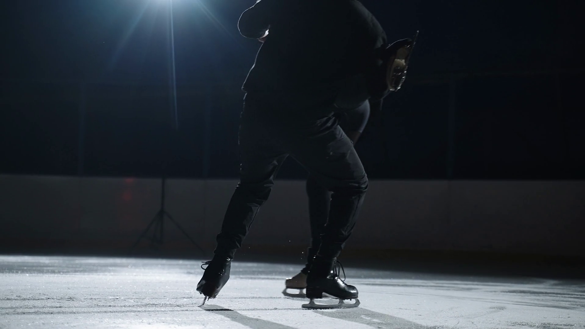 man and woman are performing figure skating lift and spin, professional ...