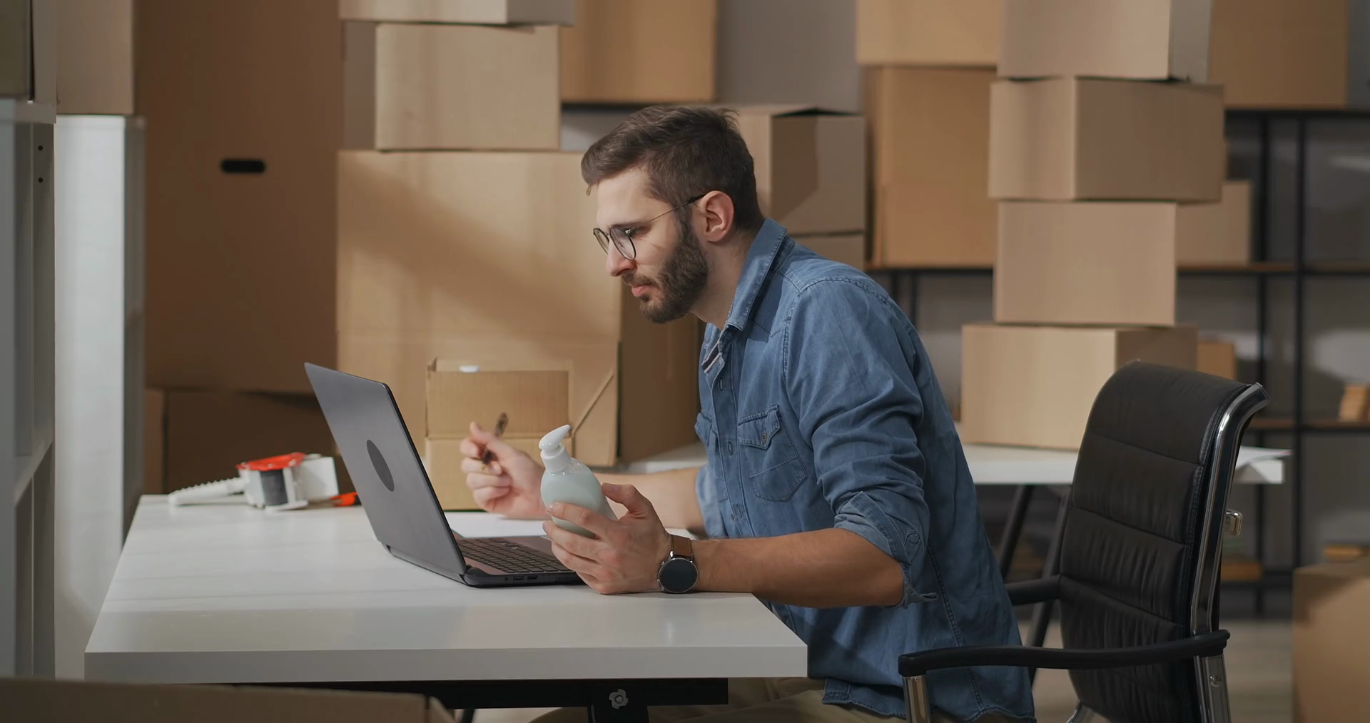 Small Business Owner With Laptop Sits At Stock Footage SBV-346434621 ...