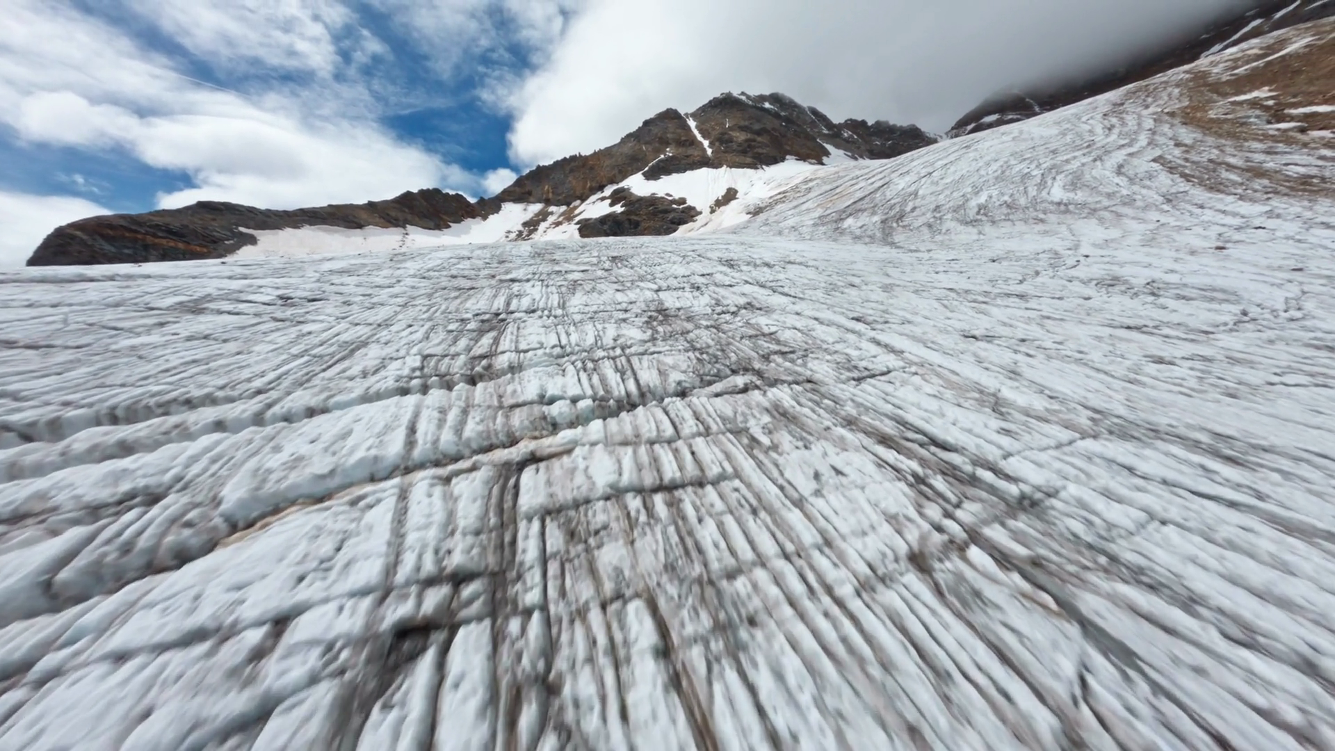 Fpv Shot Of Glacier Tongue In Alps Stock Footage SBV-352629398 ...