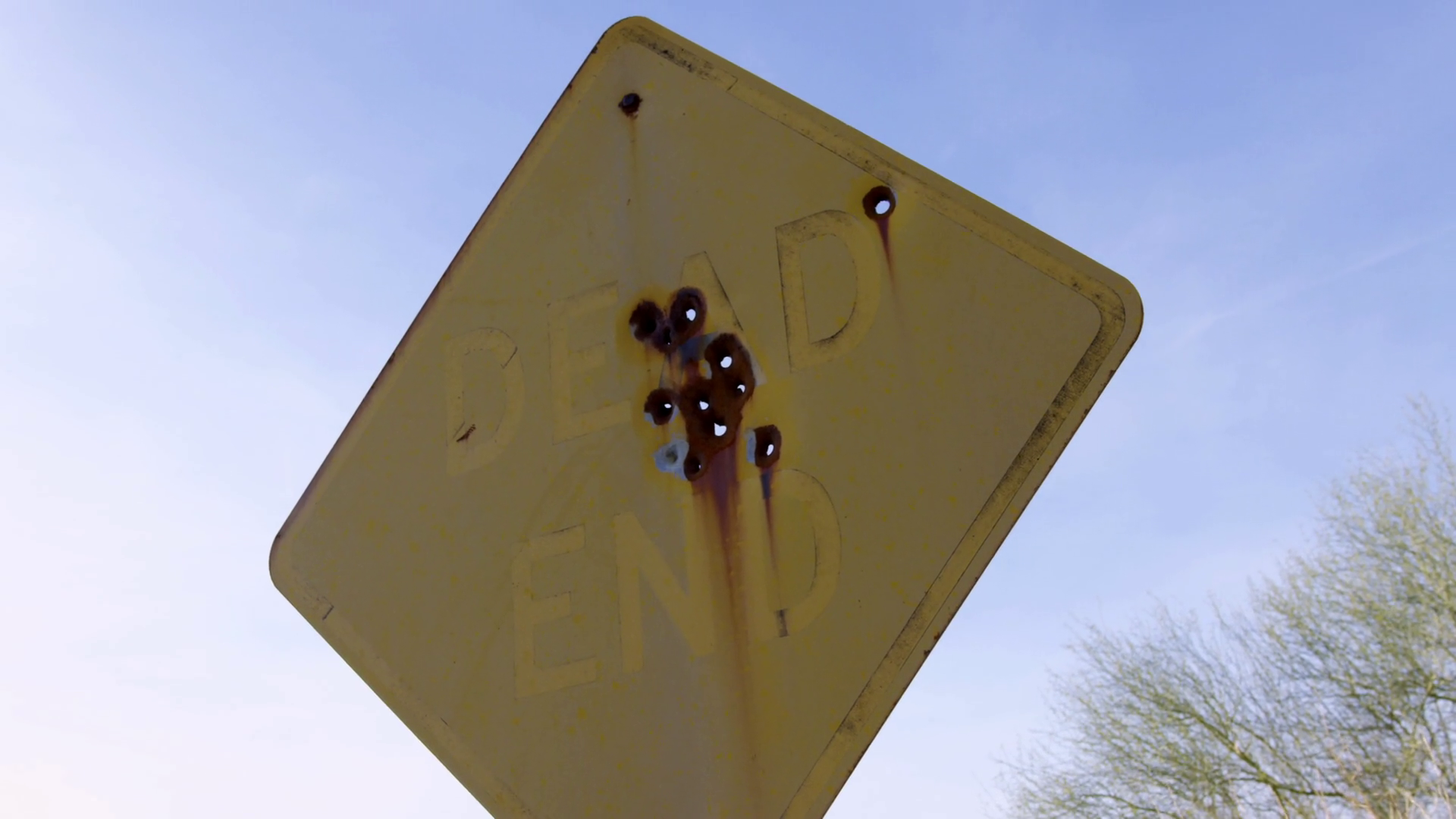 Dead End Sign With Bullet Holes Zoom In Stock Footage SBV-351907239 ...