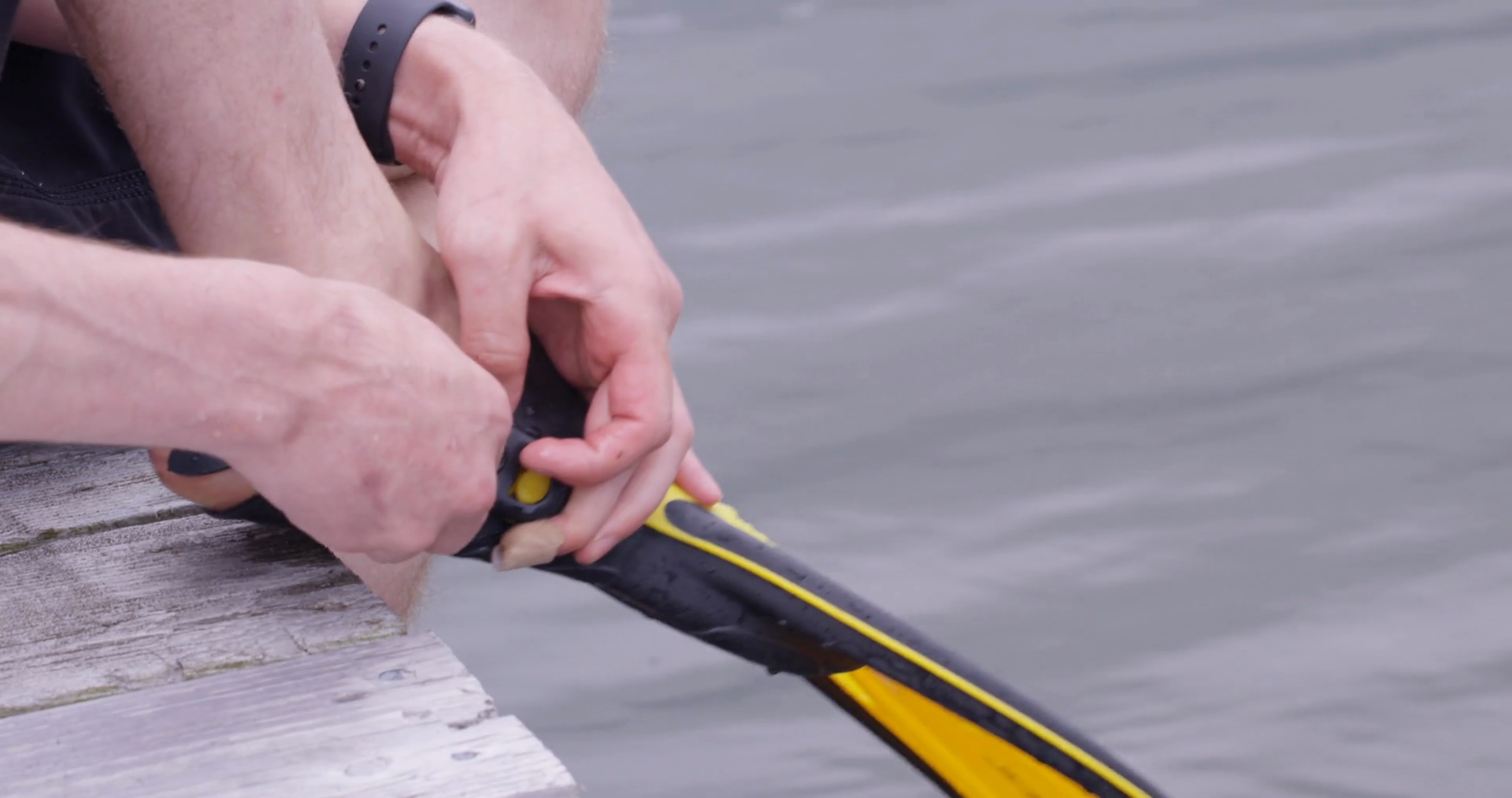 Man Adjusting Swim Flippers On Feet Slow Stock Footage SBV-347706911 ...