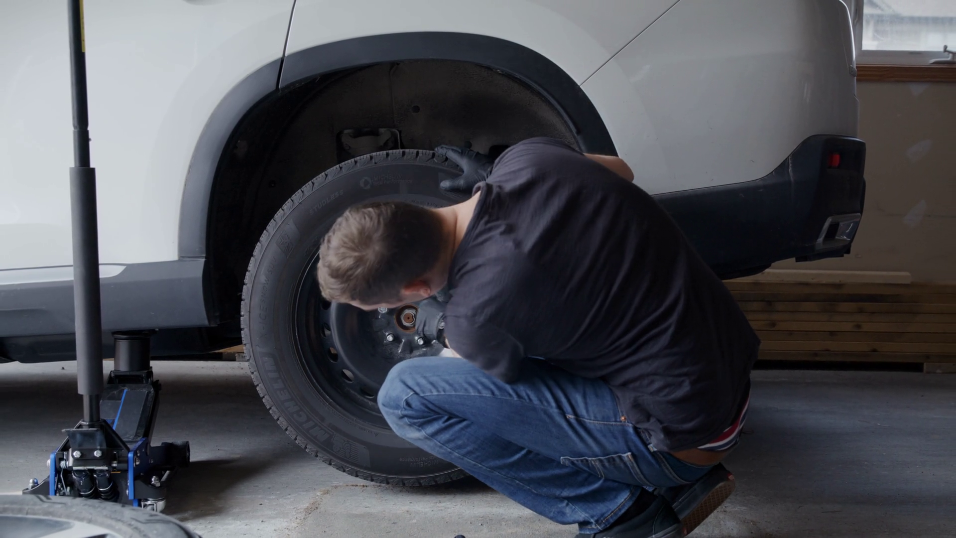 Man Loosens Lug Nuts Off Of Steel Wheel In Stock Footage SBV-352115173 ...