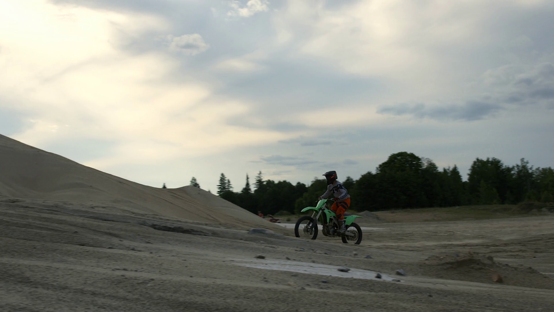 Motocross Dirt Biker Wheelies Rides Berm At Stock Footage SBV-348387490 ...