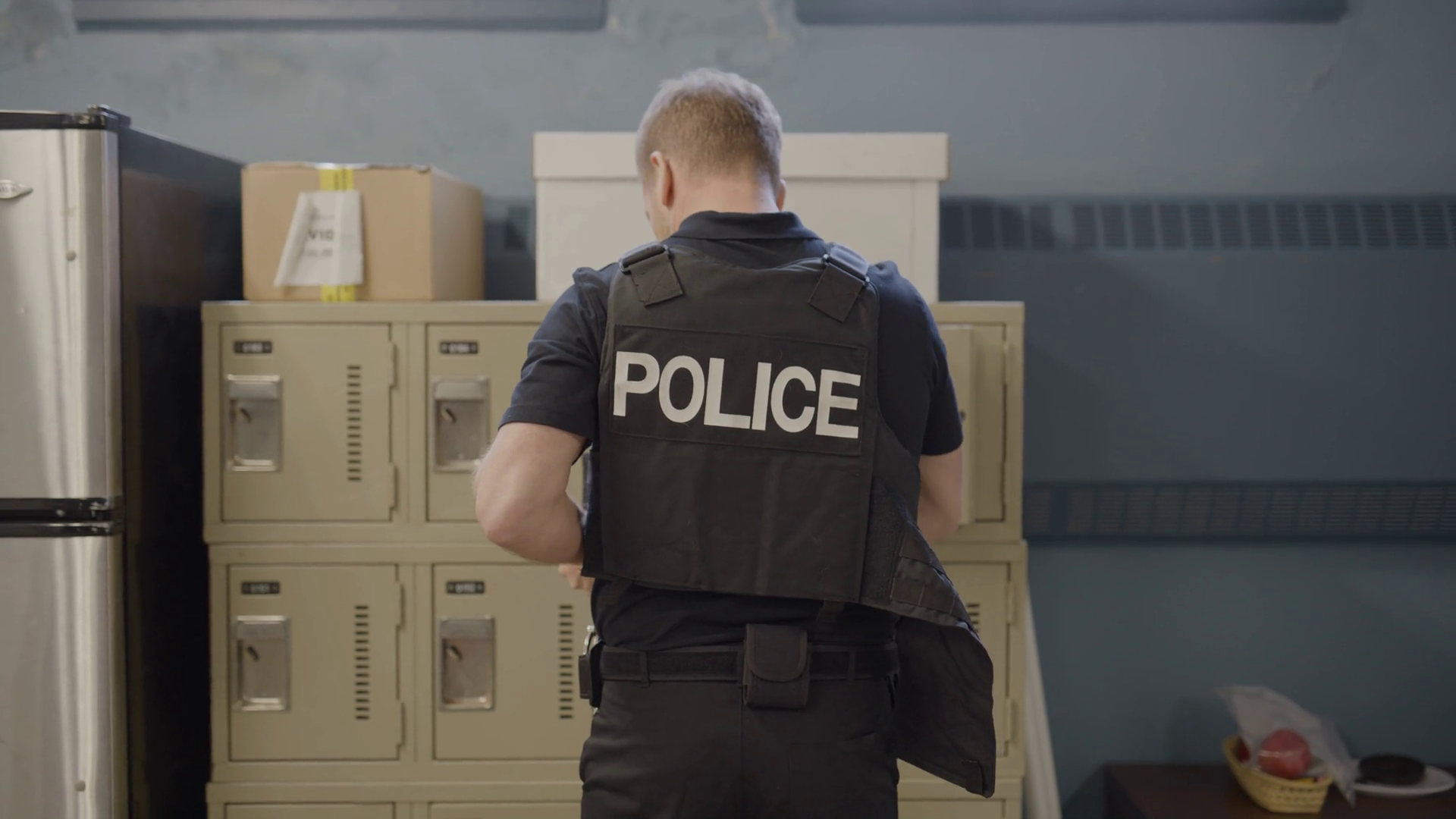 Back View Of Police Officer Strapping On Stock Footage SBV-351672564 ...