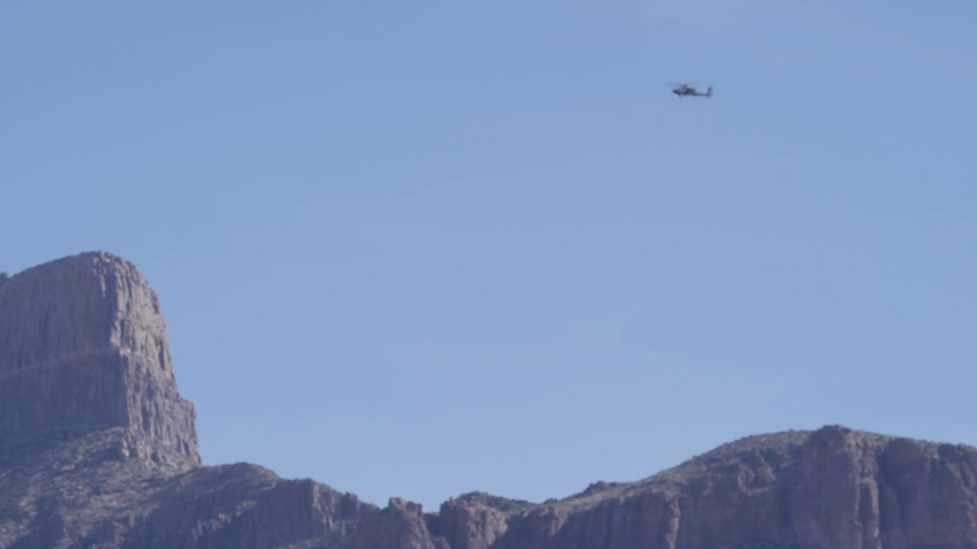 Apache Helicopter Travelling Over Mountains Stock Footage SBV-352195405 ...