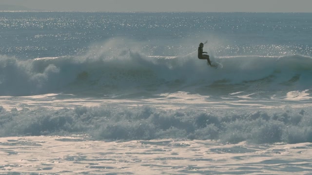 Riding Waves Stock Footage: Royalty-Free Video Clips - Storyblocks