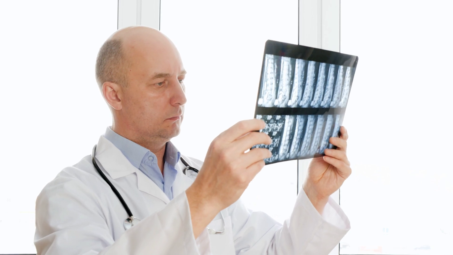 Male Radiologist In White Overall Holding Stock Footage SBV-338223122 ...