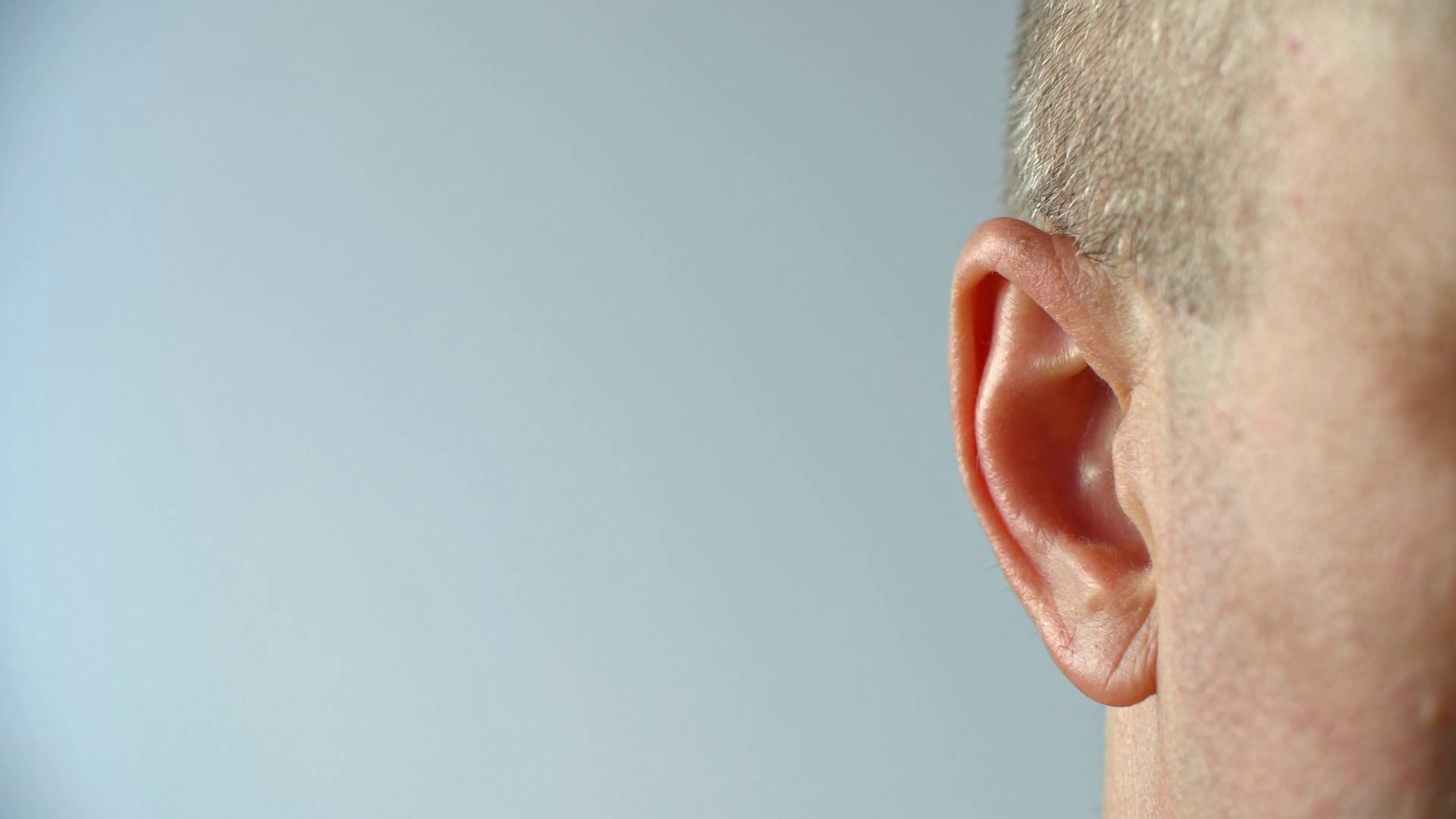 Right male ear moving while smile. Close up ear smiling adult man ...