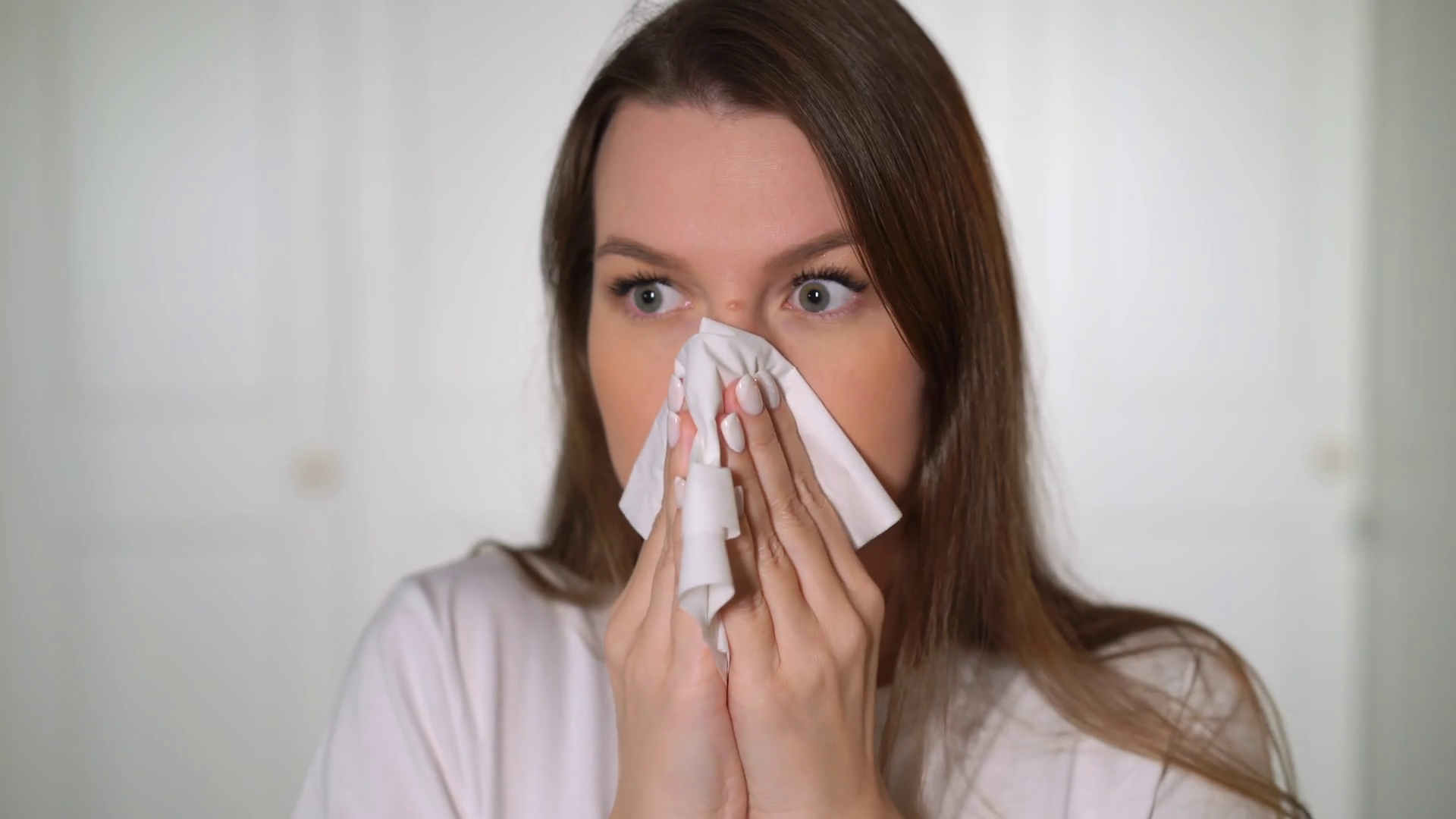 A Young Woman Blows Nose Into Paper Stock Footage SBV-352013598 ...