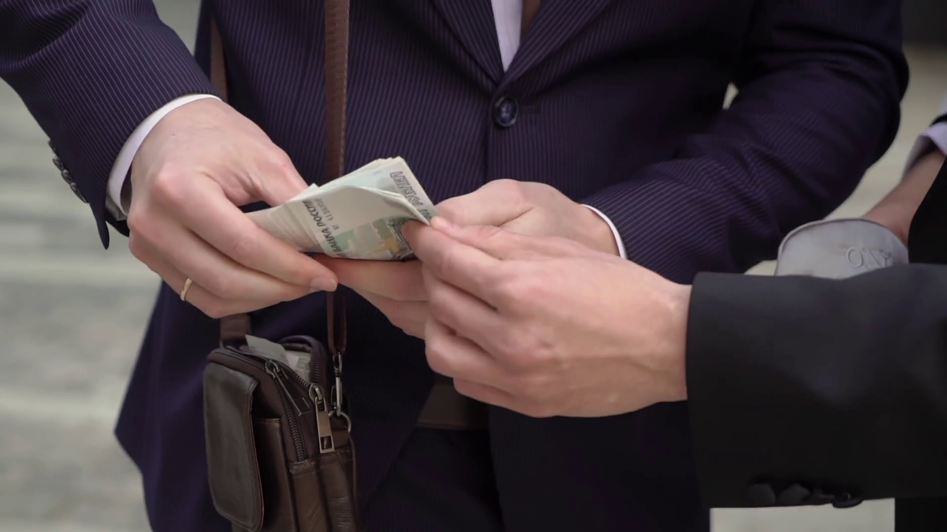 A Man Takes Money Out Of Bag Gives To Person Stock Footage SBV ...