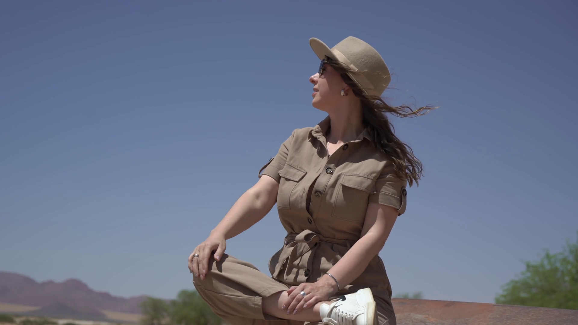 Young Woman In Safari Overalls Sits On Stock Footage SBV-352027677 ...