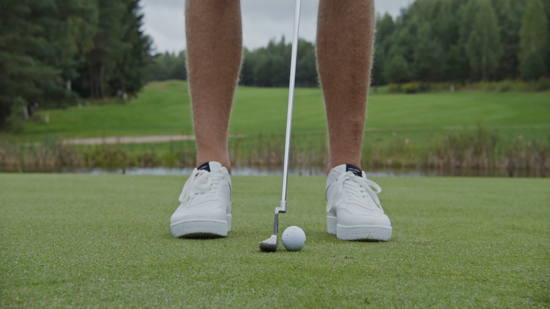 A Man In White Sneakers Hits Ball With Golf Stock Footage SBV-351801556 ...