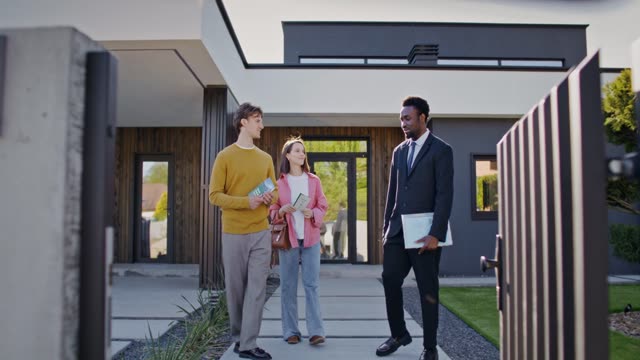 Family Walking Into Home Stock Footage: Royalty-Free Video Clips ...