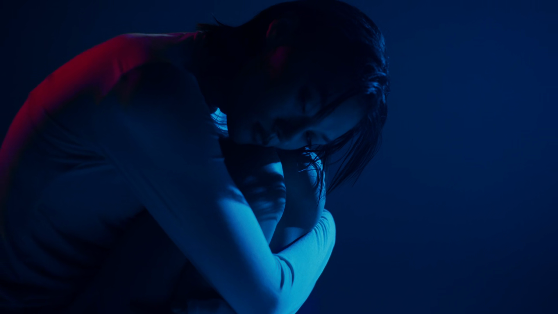 Portrait Of Sad Woman In Studio Sits Hugging Stock Footage SBV ...