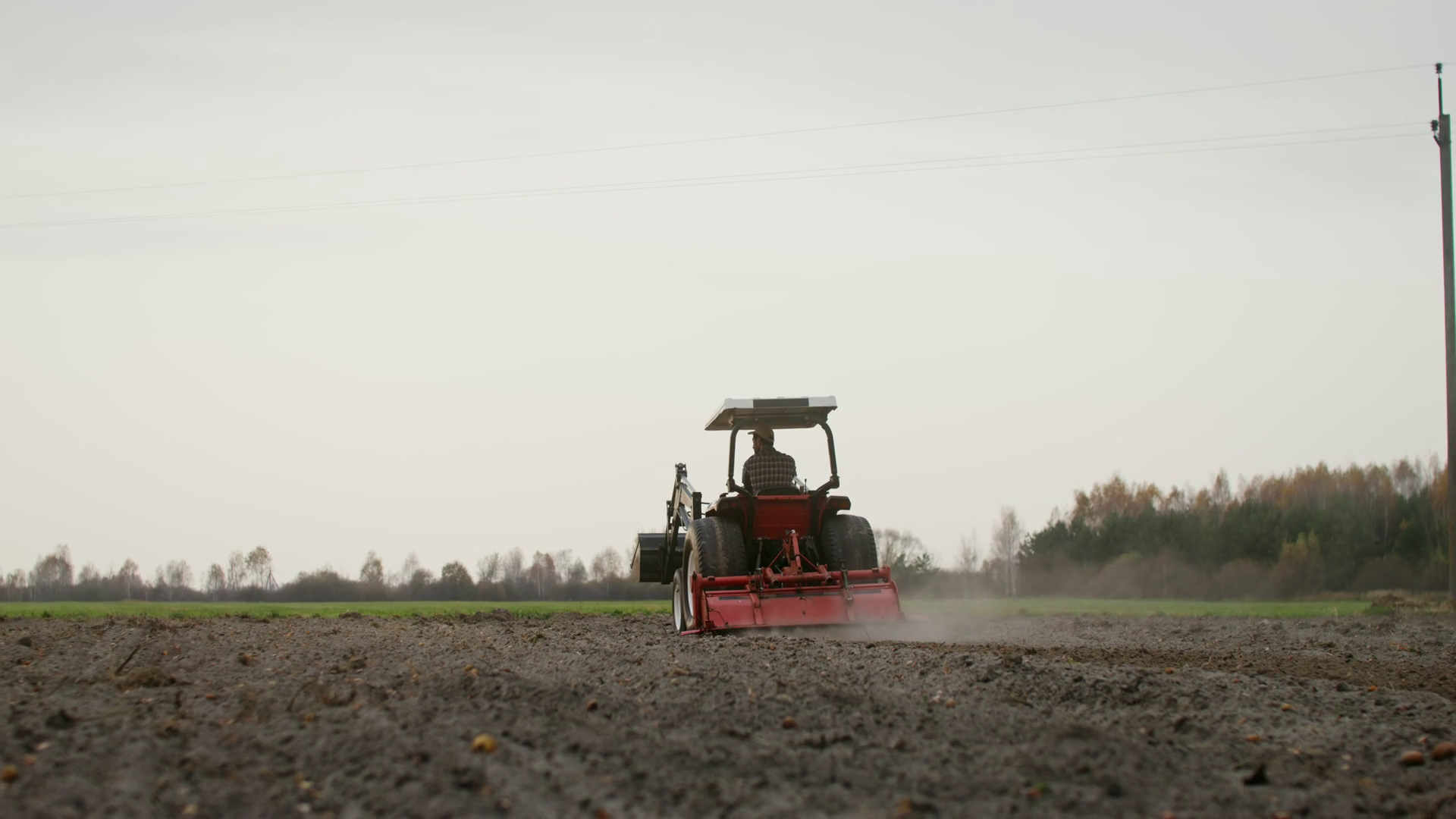 A Farmer Plows Field On Small Tractor Stock Footage SBV-347743927 ...