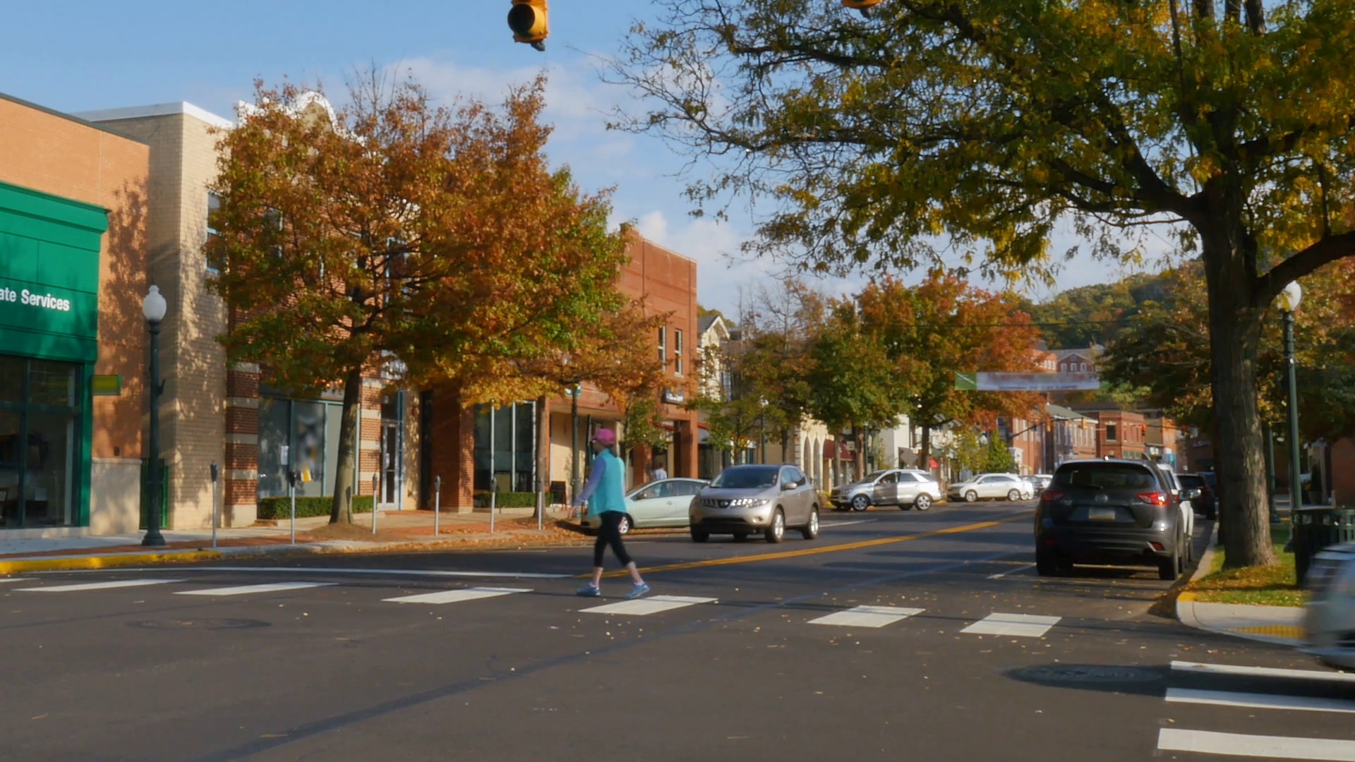 A daytime establishing shot of businesses on a typical Main Street in ...