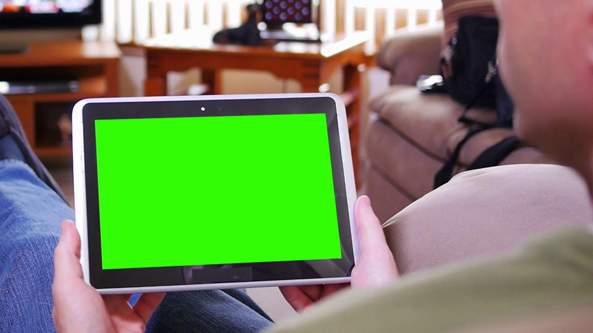 A Man Watches Television Holding Tablet Stock Footage SBV-307990367 ...