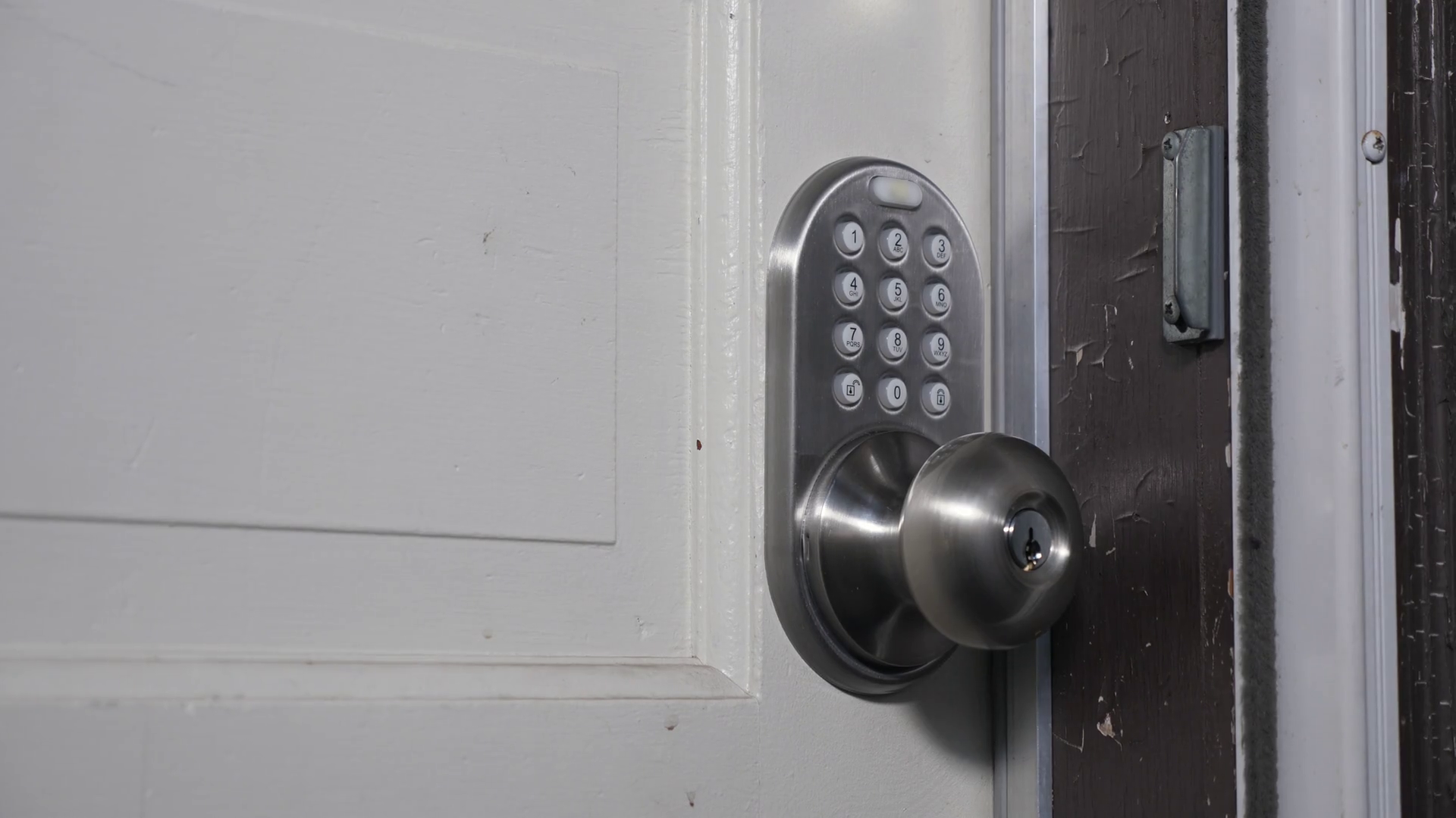A Homeowner Enters Passcode On Door Entry Stock Footage SBV-319059904 ...