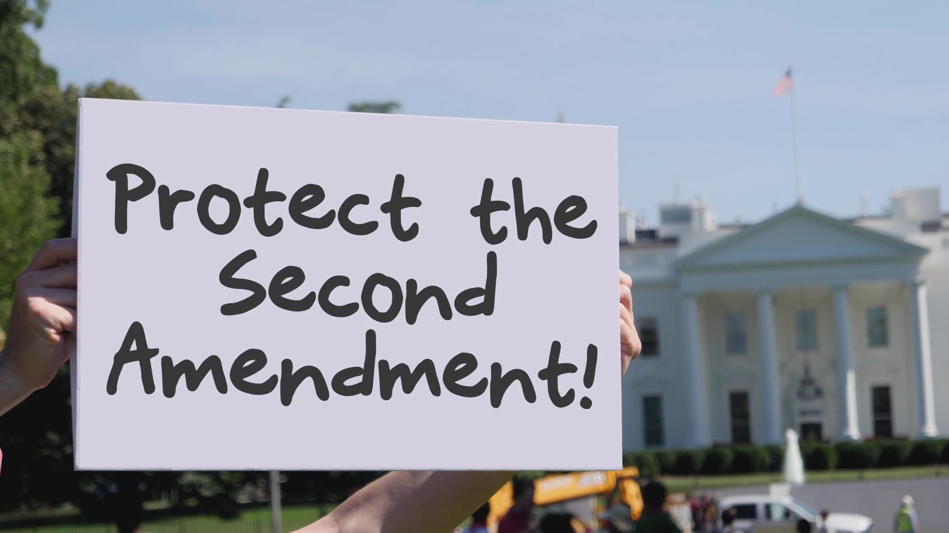SB0211 A man holds a Protect the 2nd Amendment protest sign in front of ...