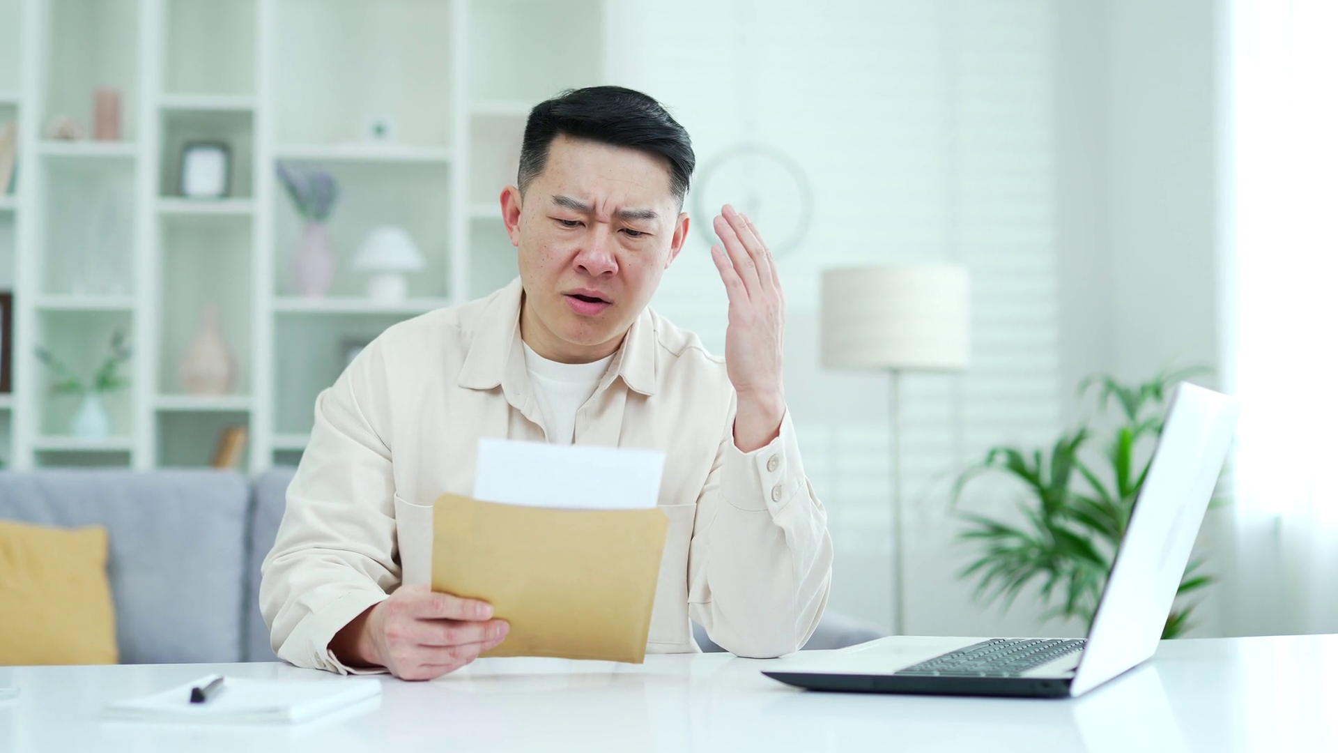 Disappointed Asian Man Reading Letter With Stock Footage SBV-352107863 ...