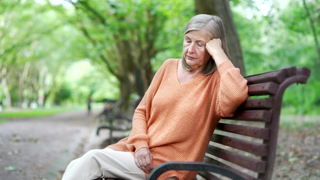 Woman Sitting With Arms Around Knees Head Down Stock Footage: Royalty-Free Video Clips - Storyblocks