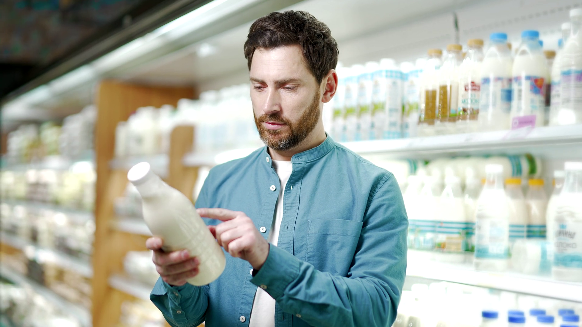 Man Examines Composition Of Dairy Products Stock Footage SBV-352100840 ...