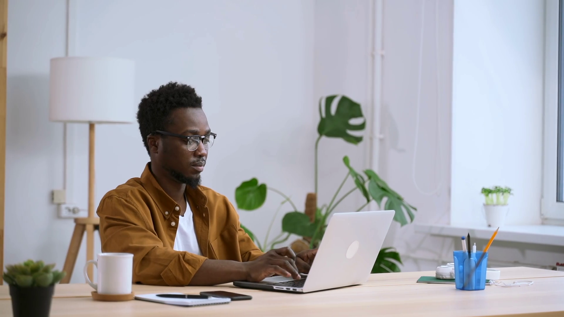 African Man Working On Computer Phone In Stock Footage SBV-346729844 ...