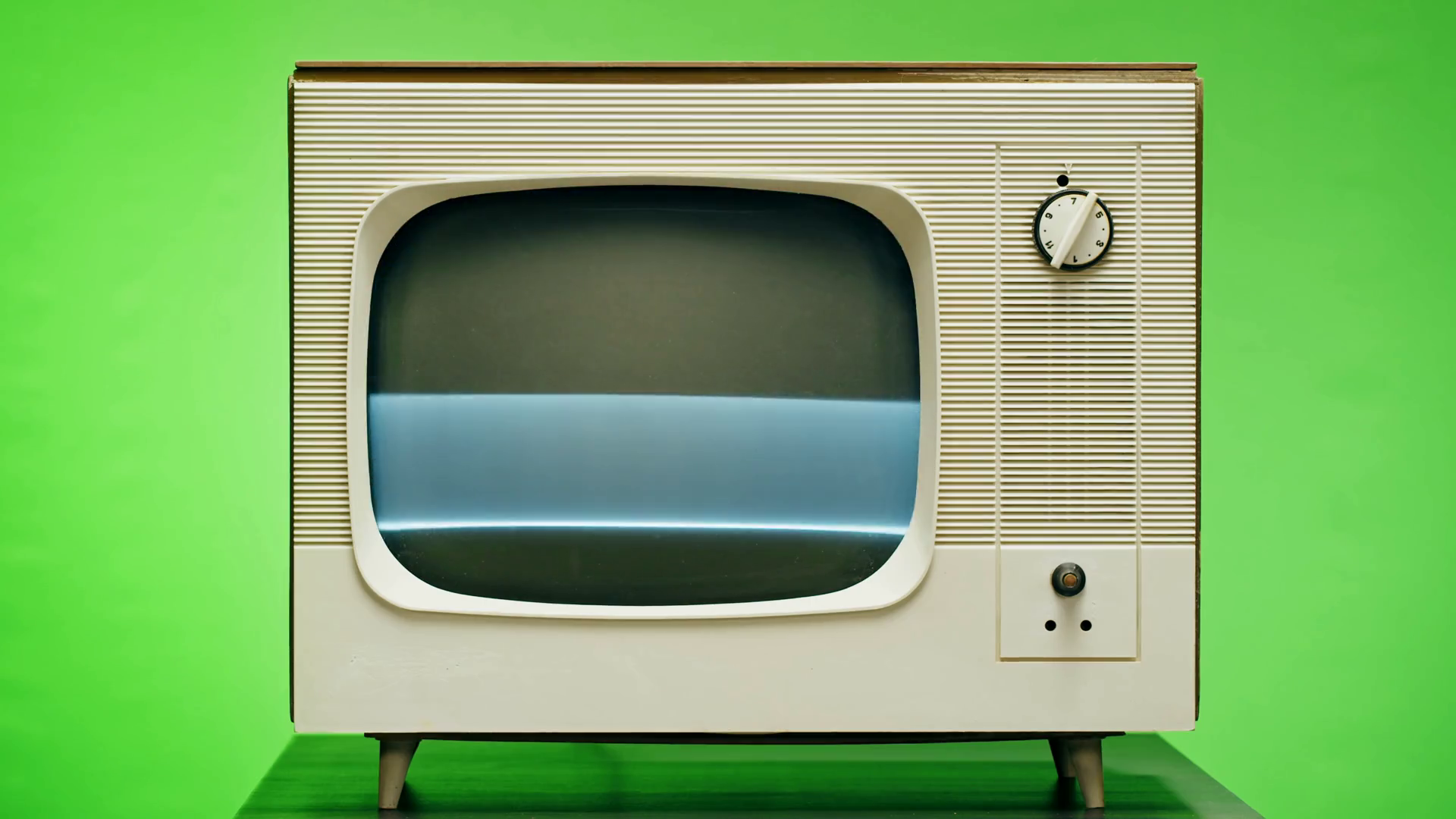 Old television with grey interference screen on chroma green background ...