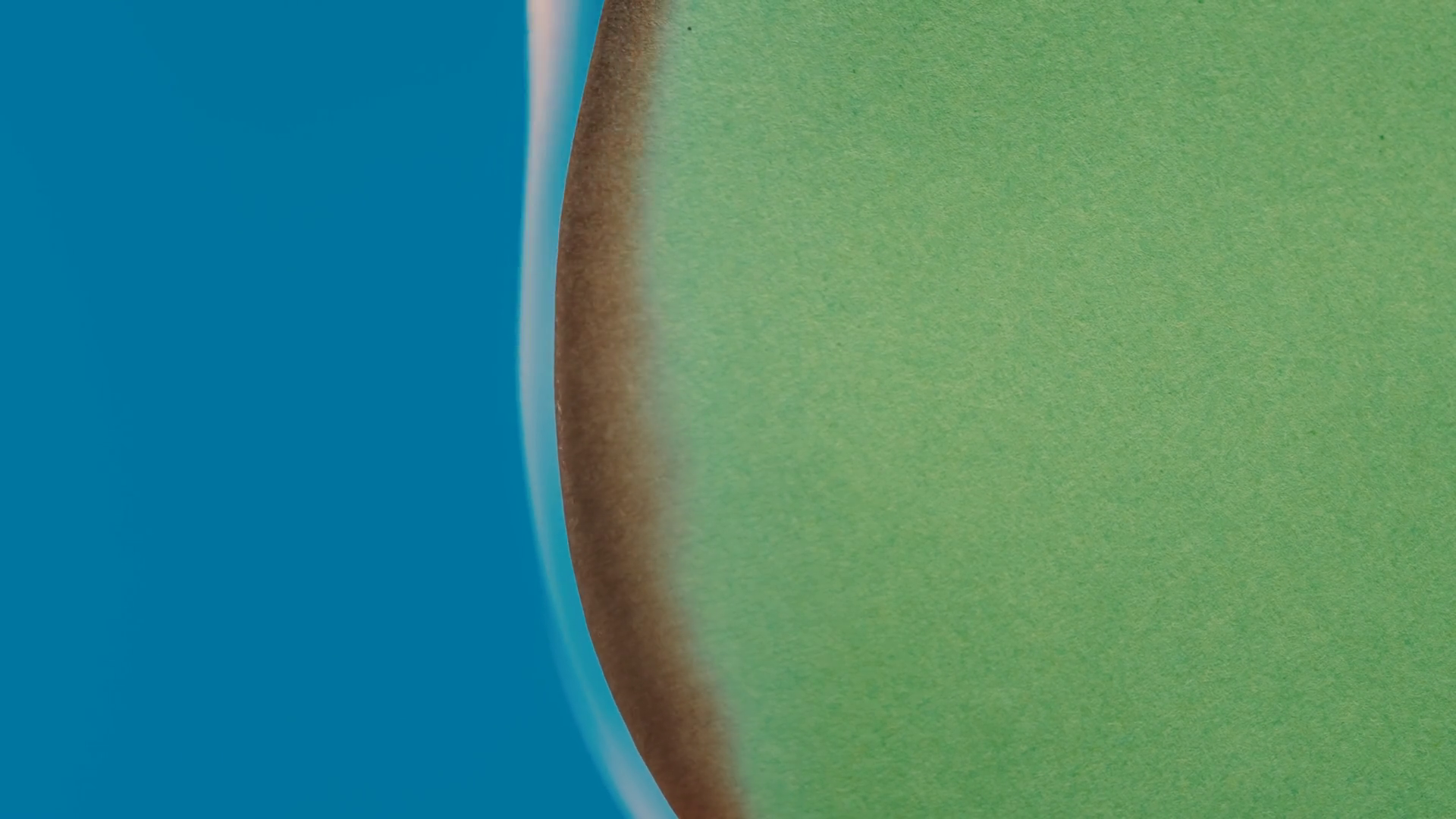 Fire flame texture close-up. Burning green paper on blue chroma key ...