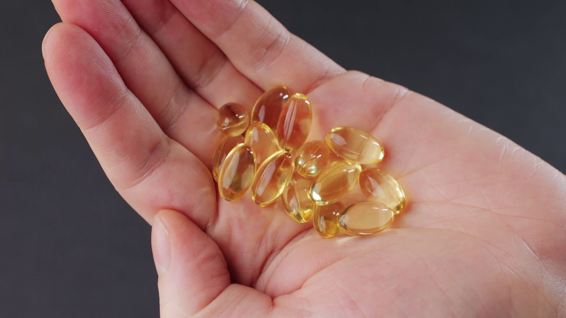 Omega Fish Oil Gel Capsules On Man Hand Stock Footage SBV-348722748 ...