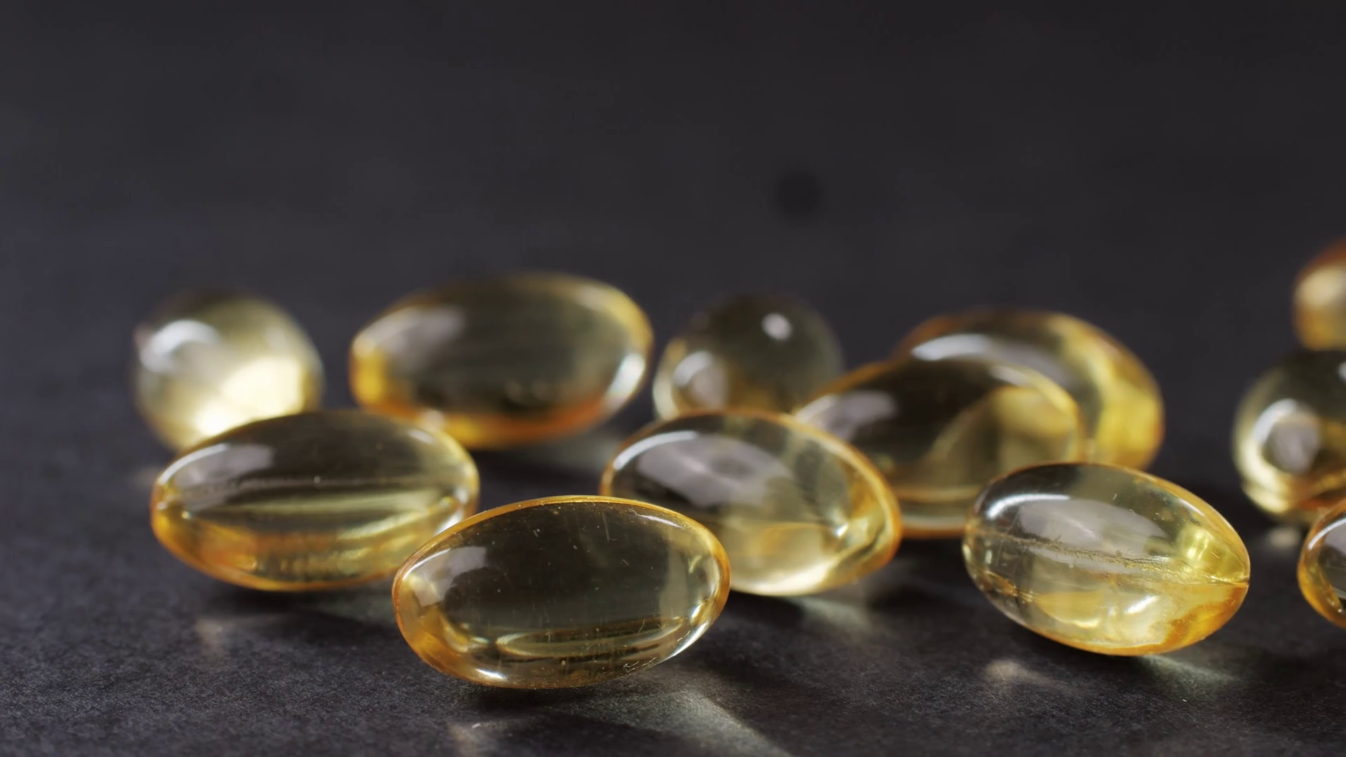 Omega Fish Oil Gel Capsules On Black Stock Footage SBV-348672101 ...