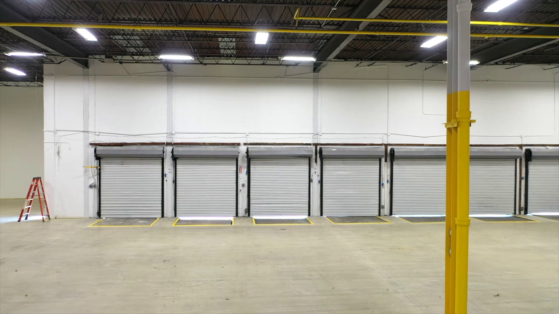 Aerial Close Up View Of A Large Commercial Warehouse Loading Doors ...