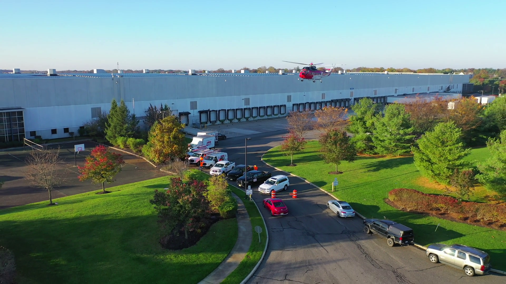 View Of A Heavy Lift Helicopter Landing At A Large Warehouse Stock ...