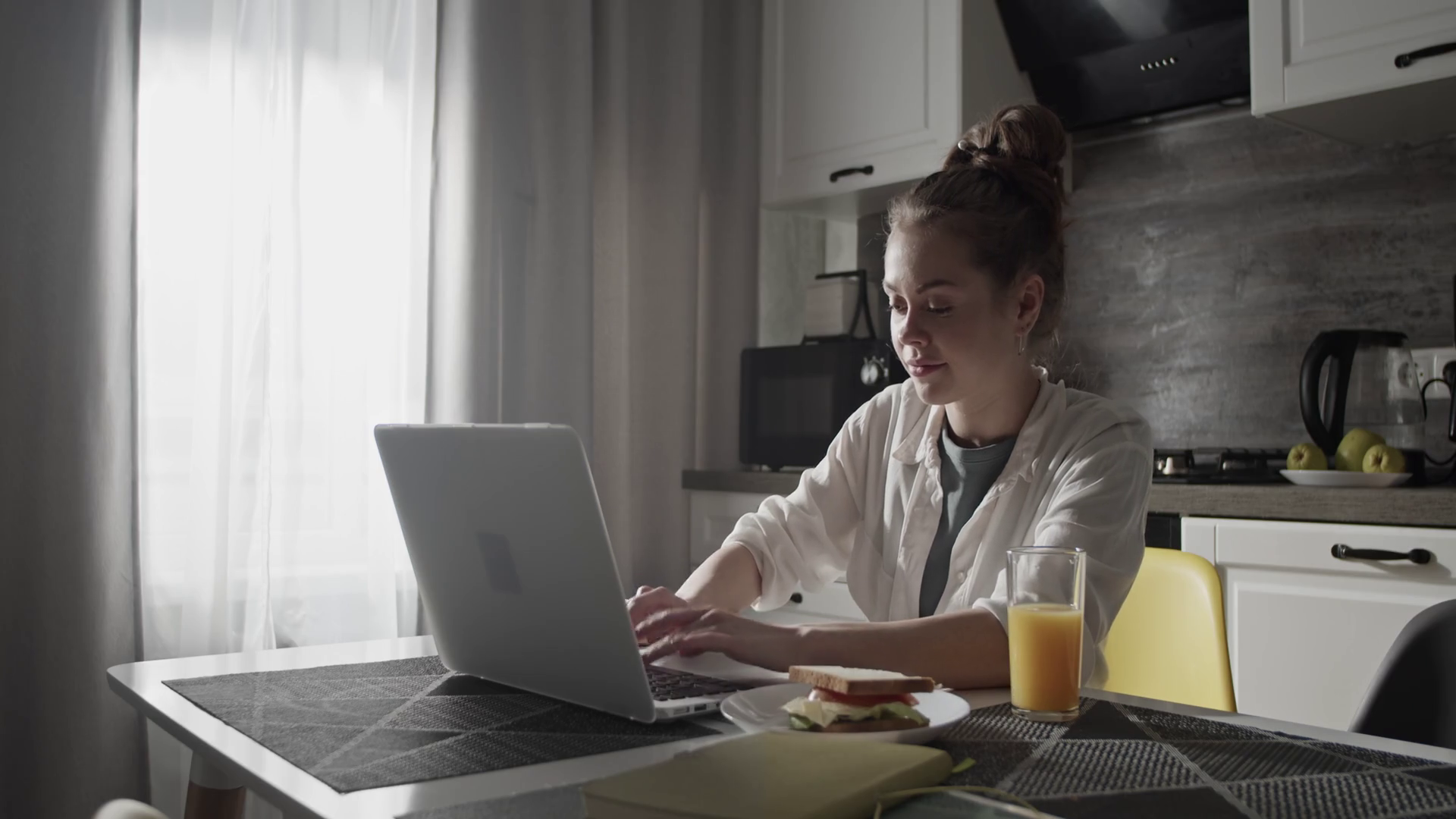 Young Woman Studying In Kitchen Stock Footage SBV-347503149 - Storyblocks