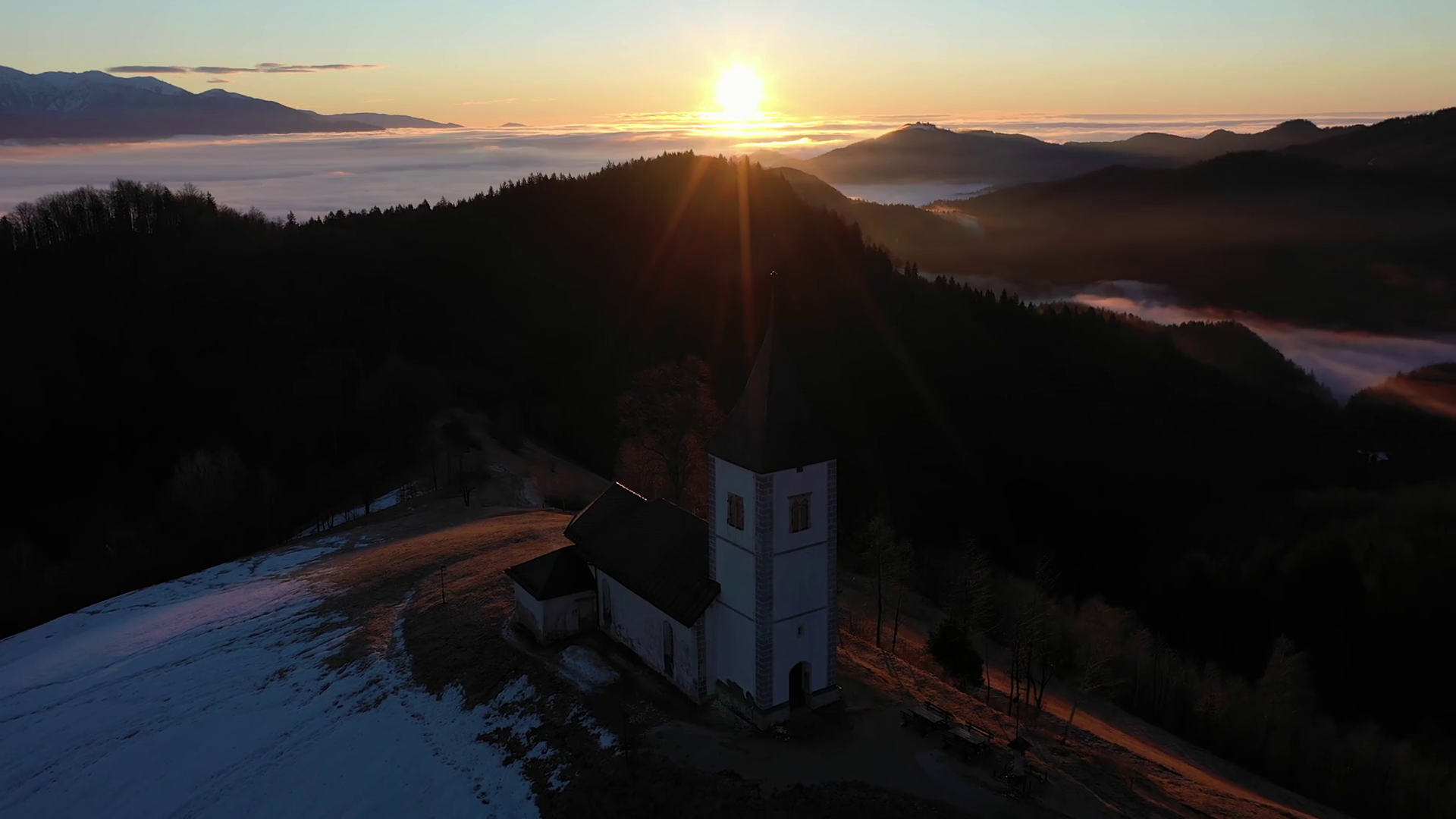 Church of St. Primoz and Felicijan at Sunrise above the Clouds. Julian ...