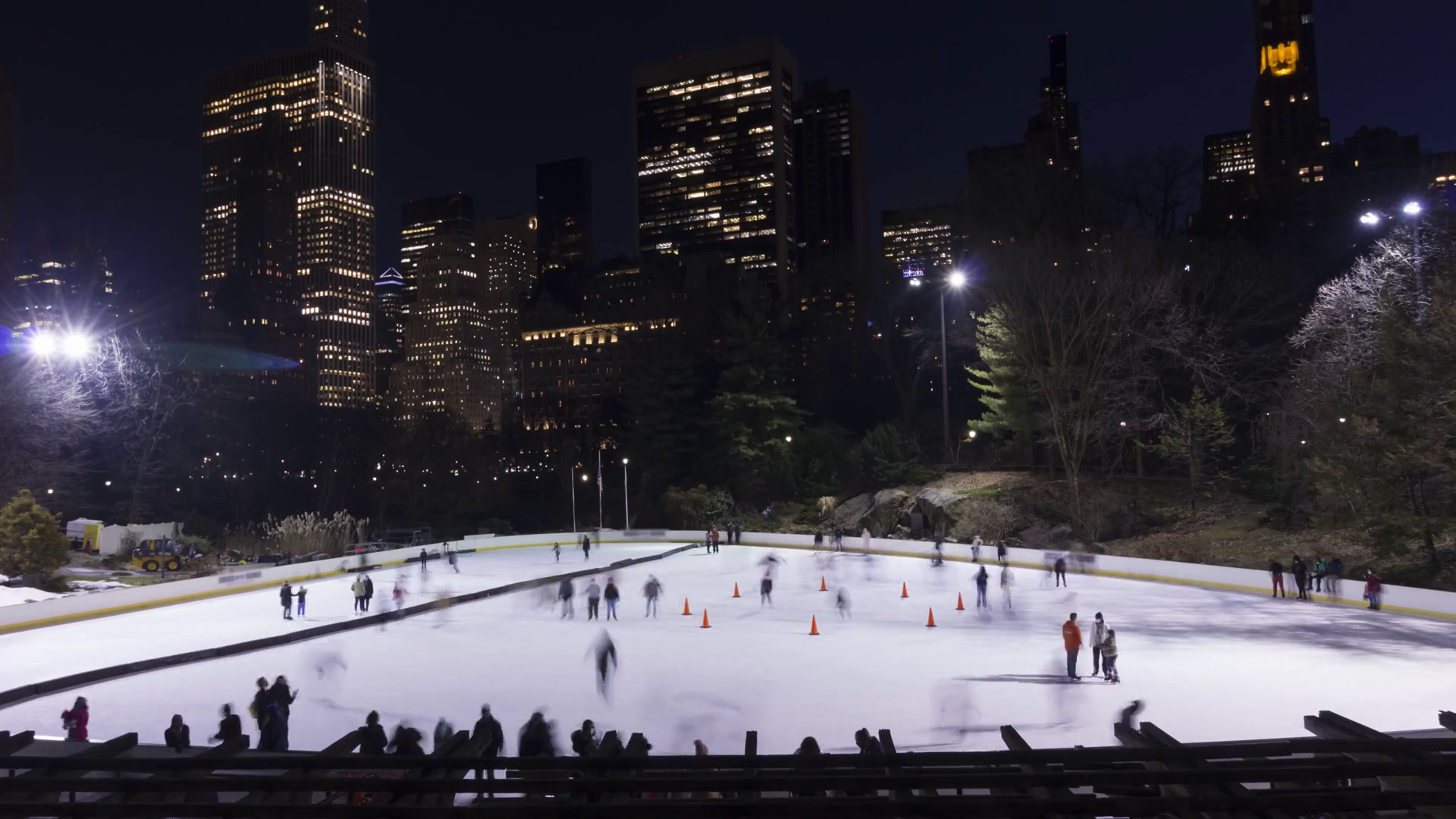 People Ice-Skating on Ice-Rink in Central Park in the Evening. Midtown ...
