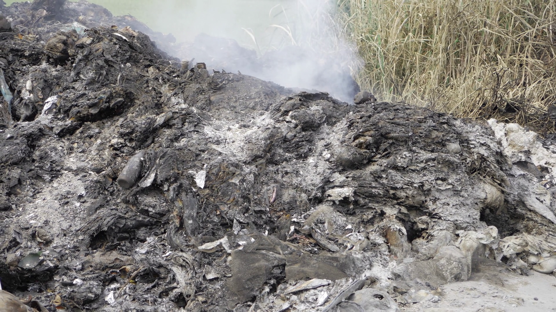 Uncovering Mysteries Of Smoldering Trash Pile Stock Footage SBV ...